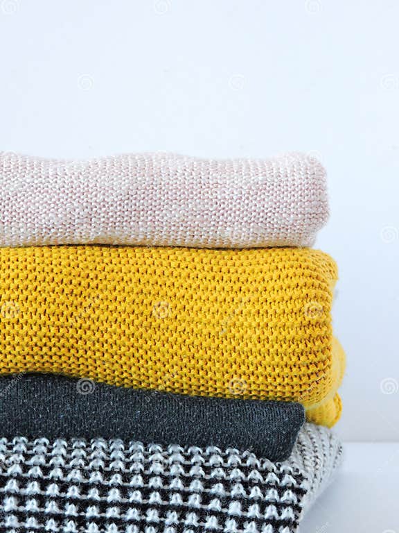 Stack of Various Sweaters Isolated on White Background. Knitted Wool ...