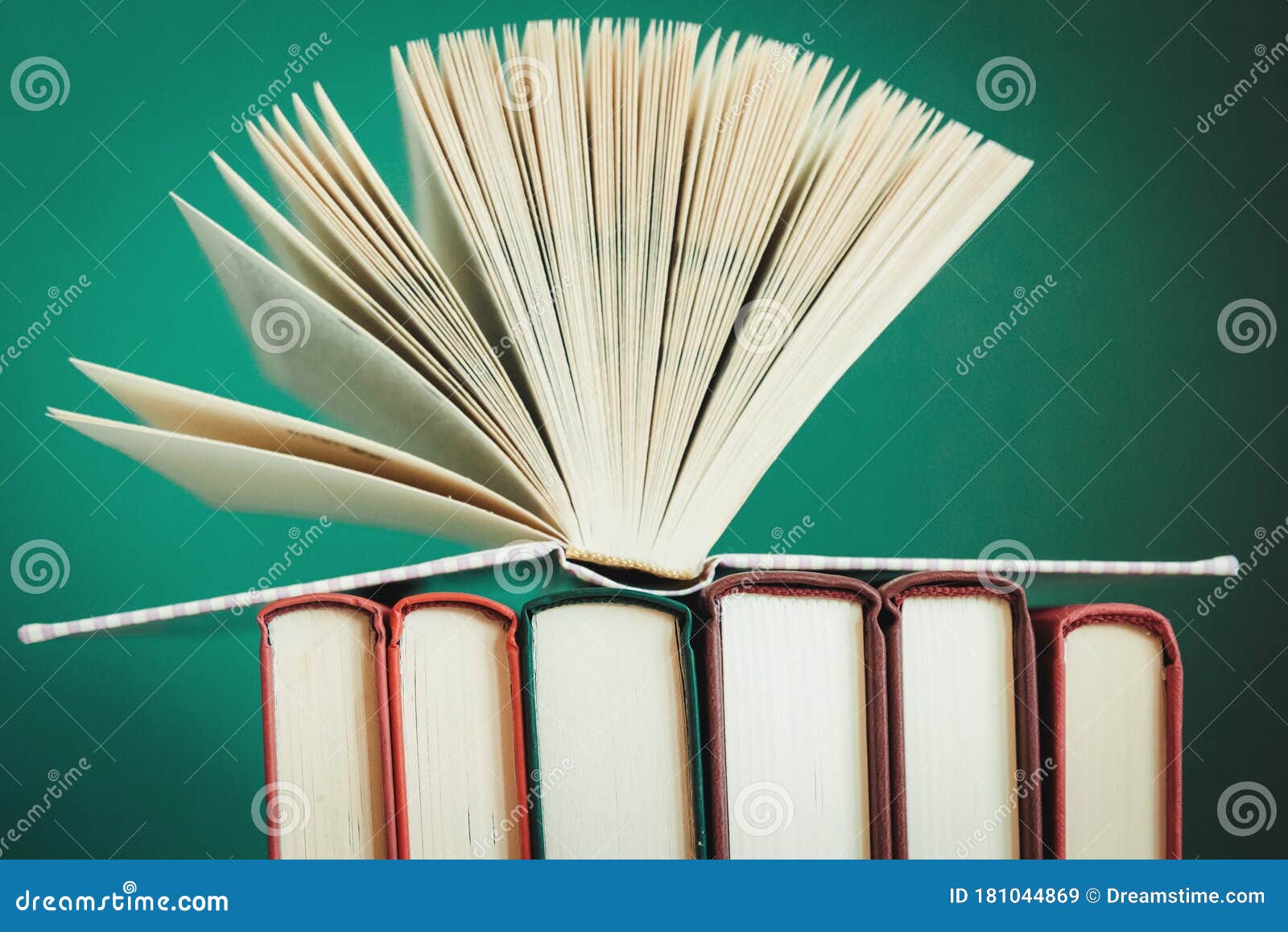 Stack of Vintage Books on a Blue Background Stock Image - Image of ...