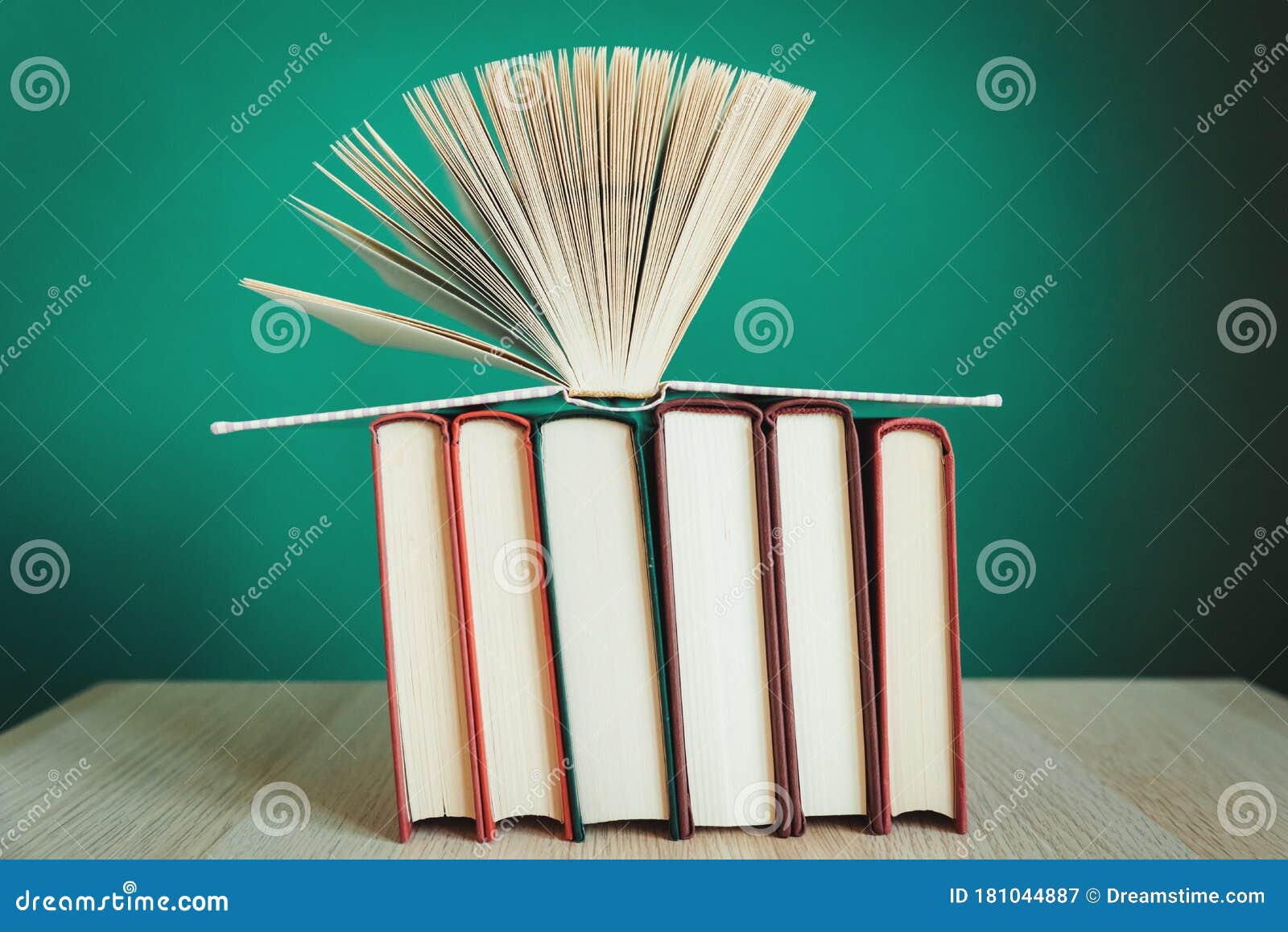 Stack of Vintage Books on a Blue Background Stock Image - Image of ...