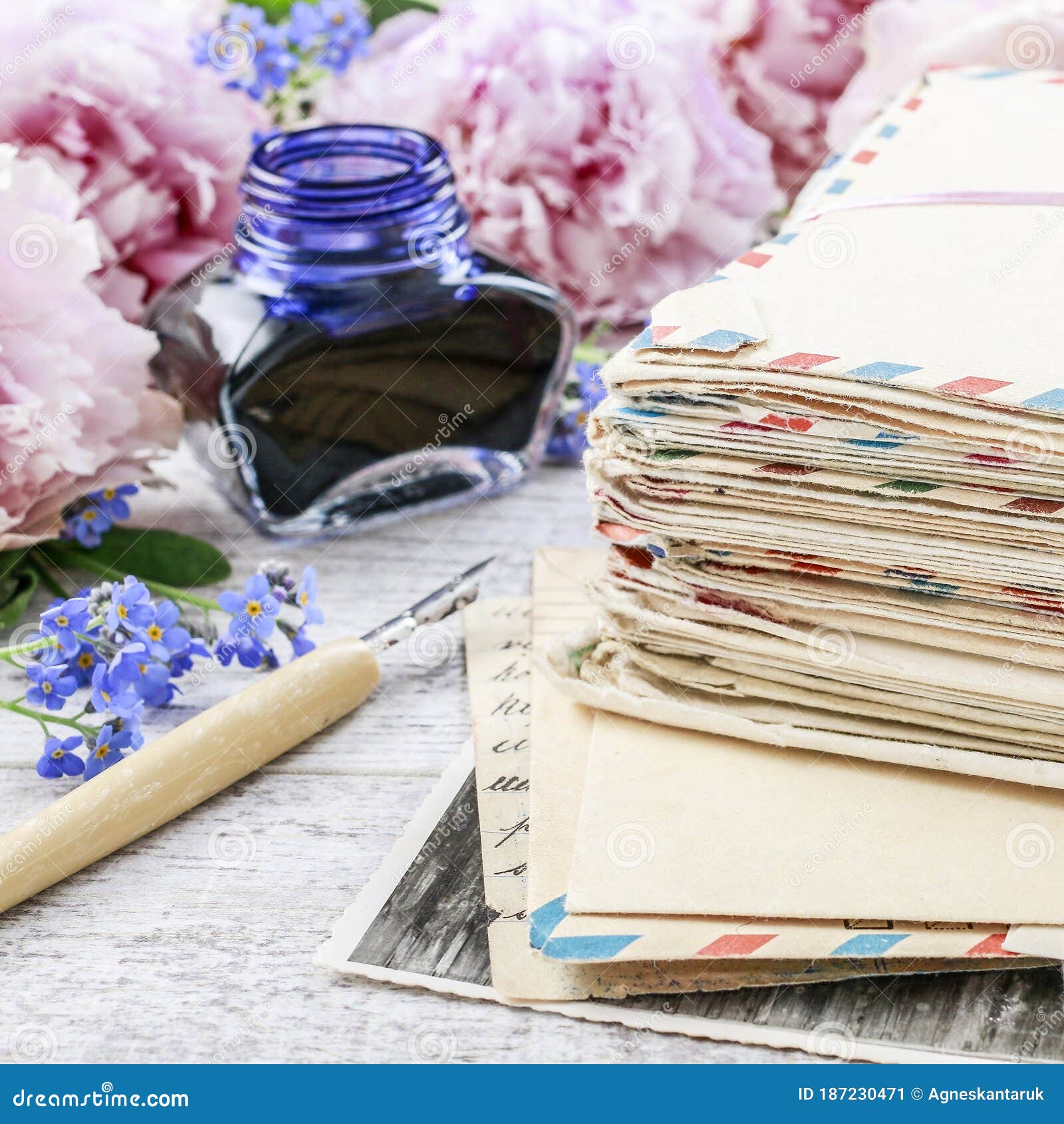 Stack of Vintage Love Letters and Pink Peonies in the Background Stock ...