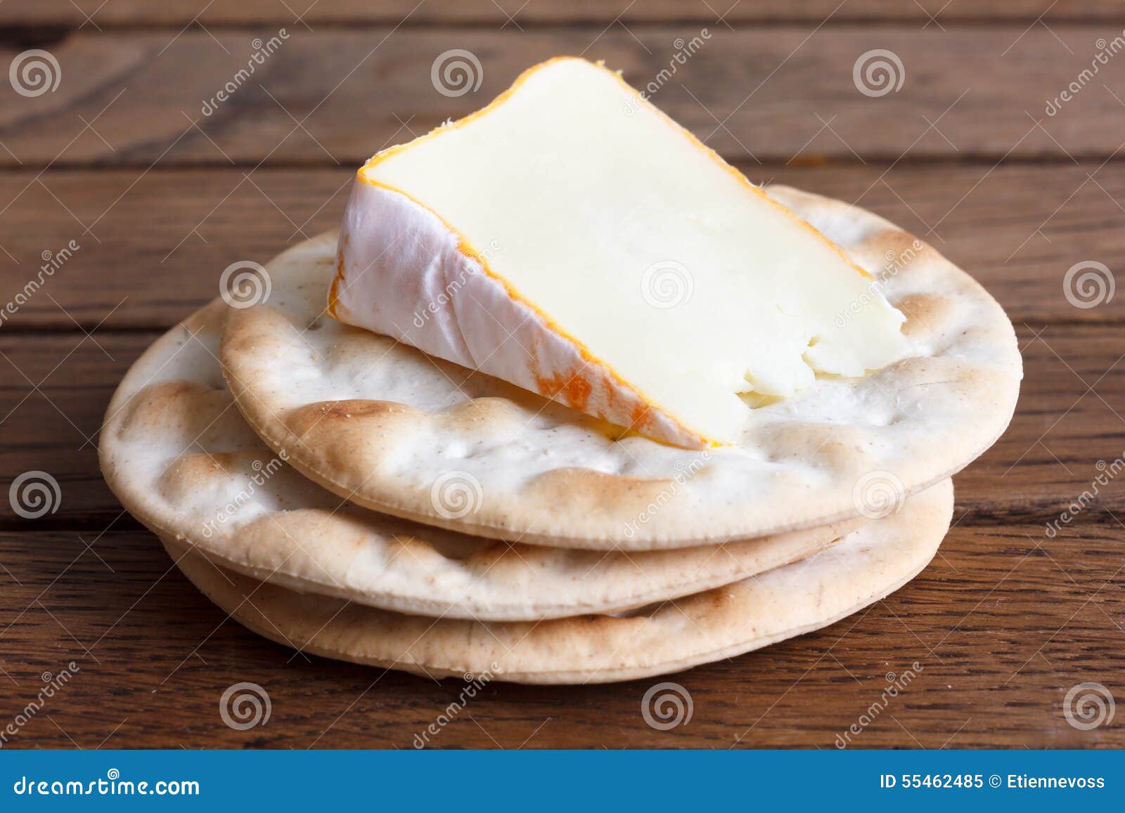 Stack of Water Biscuits with Cheese on Wood. Stock Image - Image of ...
