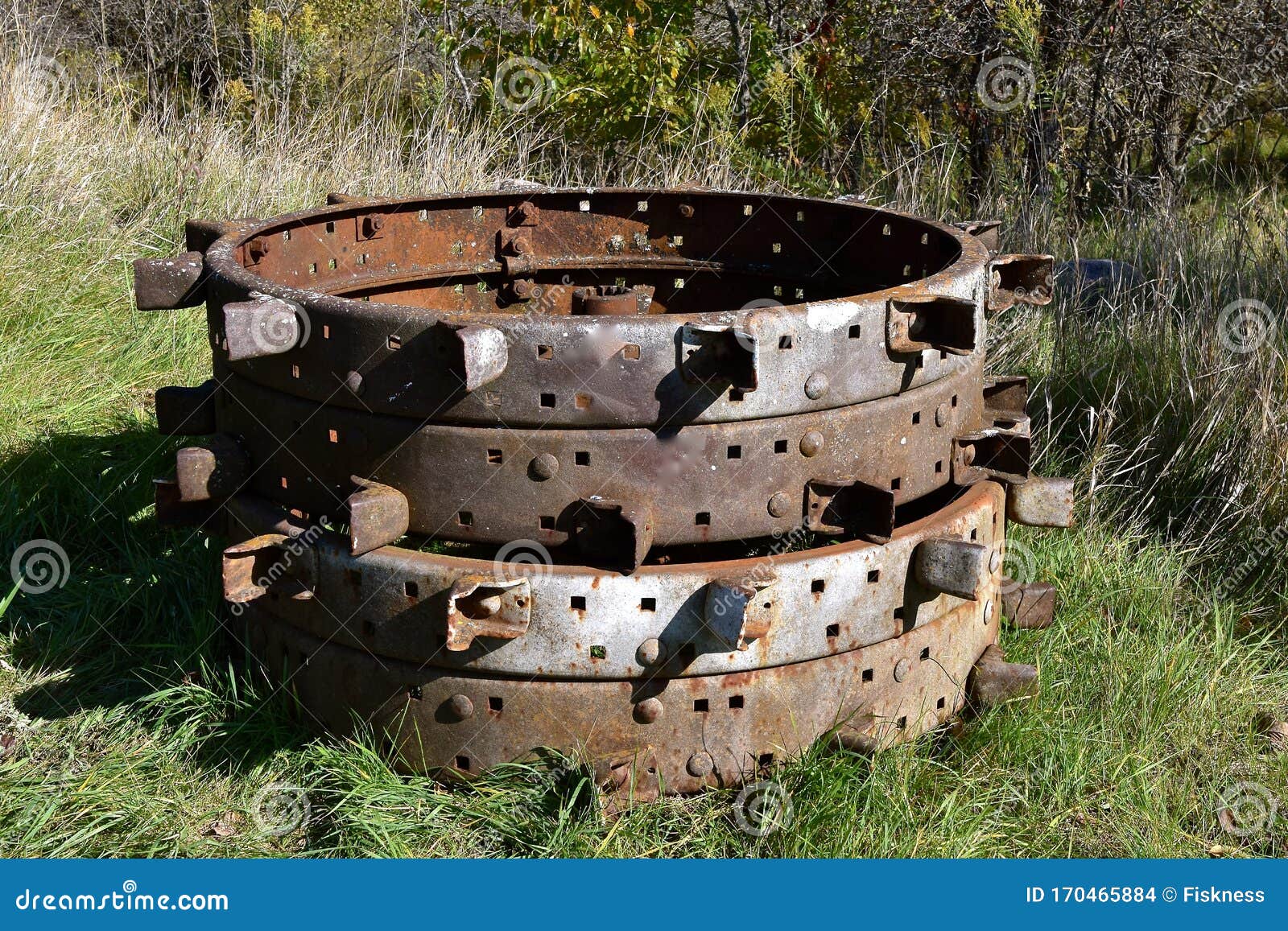 Stack of Wheels for Old Tractors Left on the Grass Stock Photo - Image ...