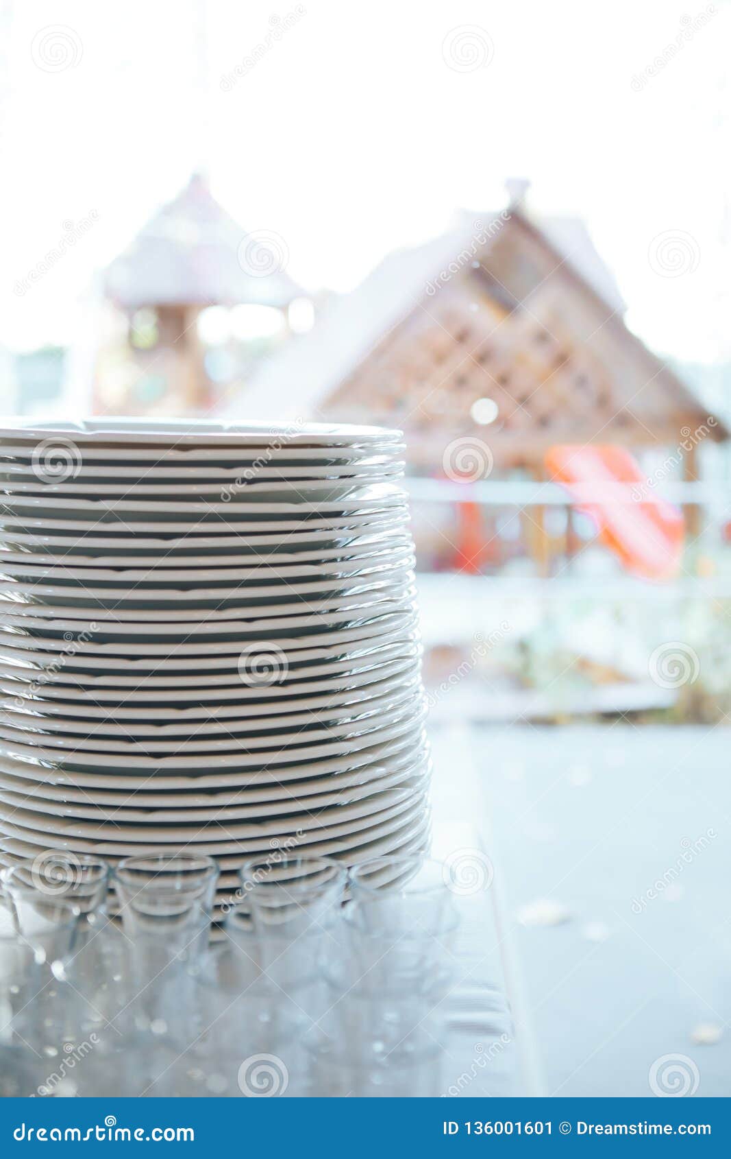 Stack of White Ceramics Plate Outdoor. Stacked White Dishes on the ...