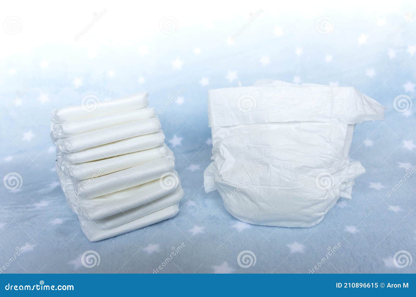 Stack of White Disposable Diapers for Little Babies on Nice Blue ...