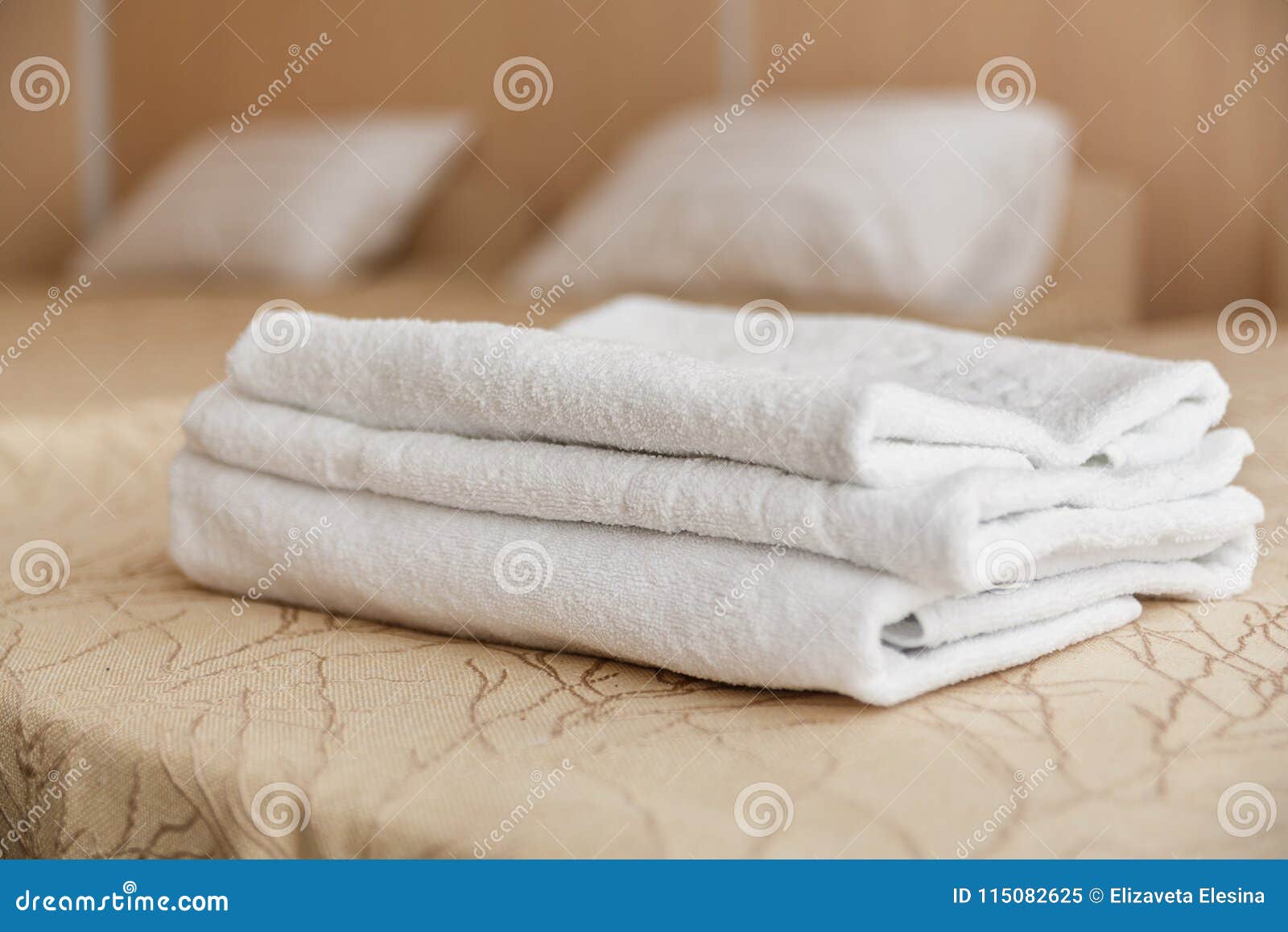 Stack of White Hotel Towel on Bed in Bedroom Interior. Stock Image ...