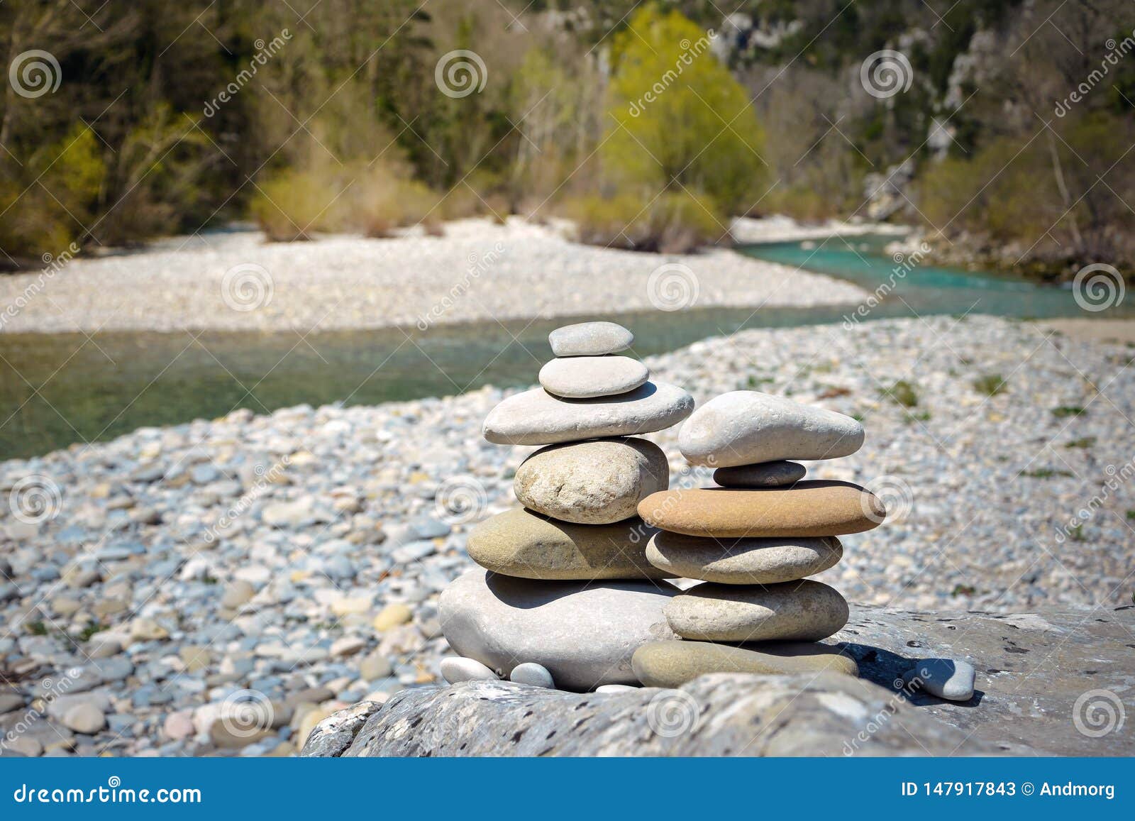Stack of White Pebbles Stone Against Blue Mountain Stream Background ...