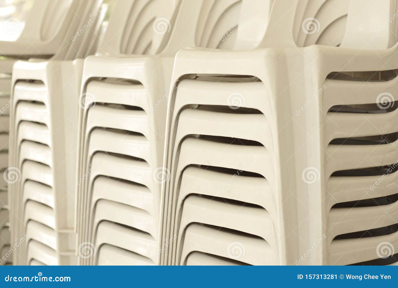 Stack of White Plastic Chairs Stock Image - Image of stack, plastic ...