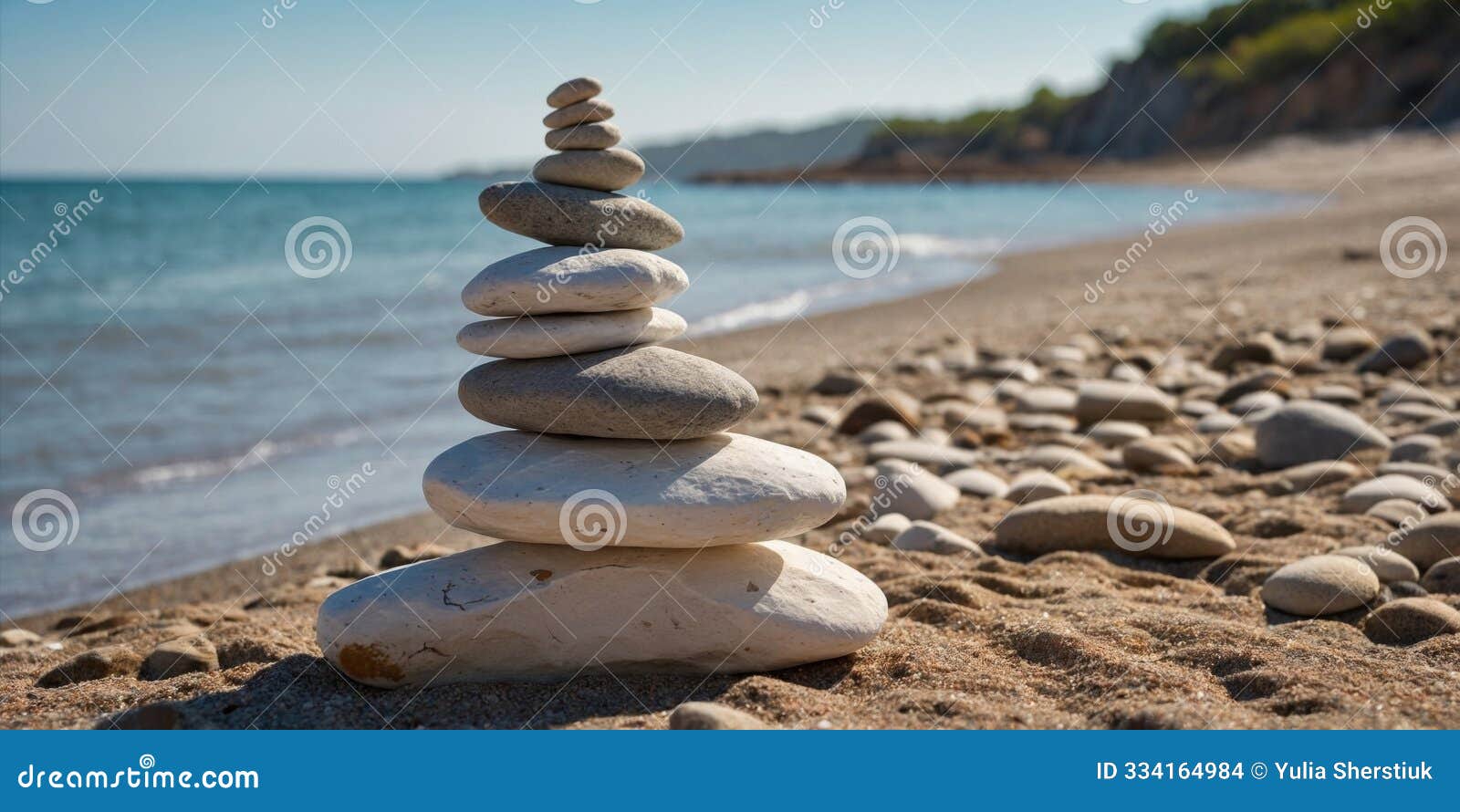 A Stack of White Rocks on a Beach with a Drawing of an Arrow Pointing ...