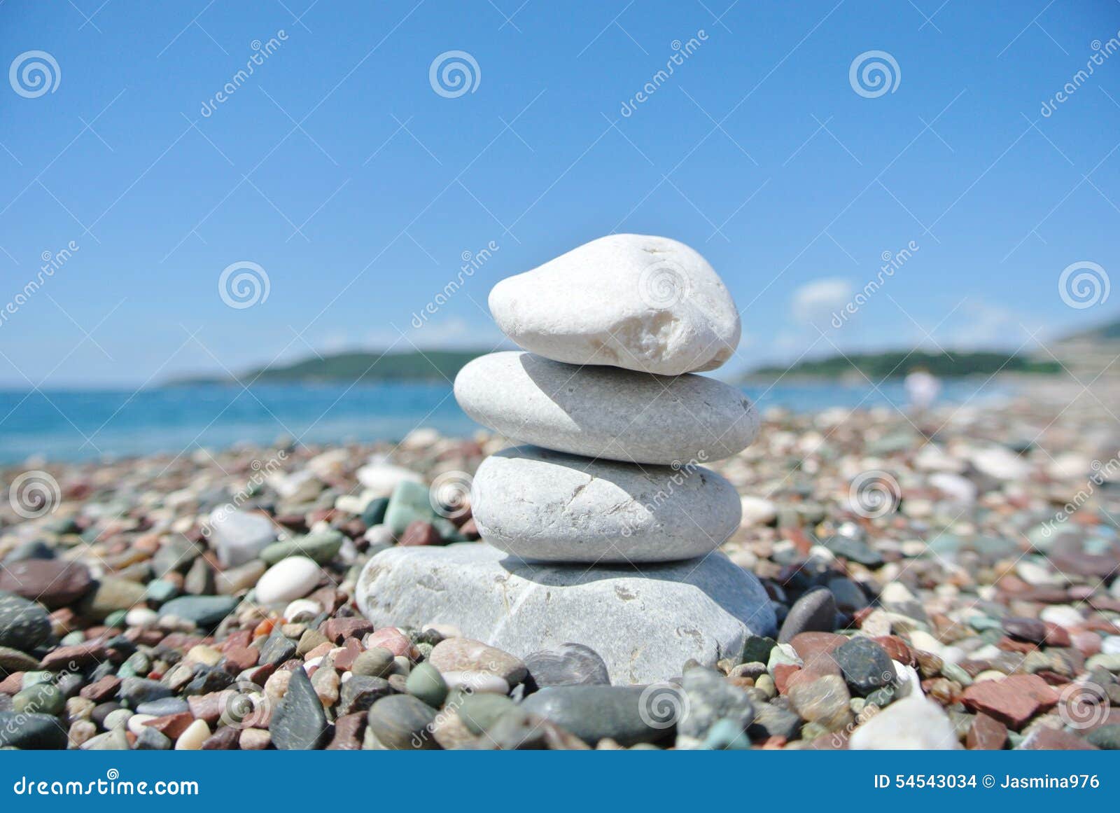 Stack of White Stones Balancing on the Pebbly Beach Stock Photo - Image ...
