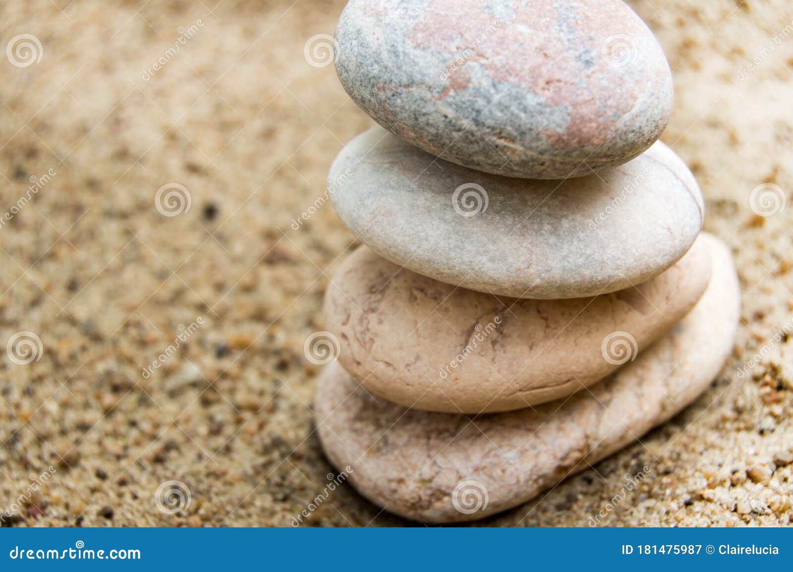 A Stack of White Stones Stacked on Yellow Sand, Low Depth of Field, Zen ...