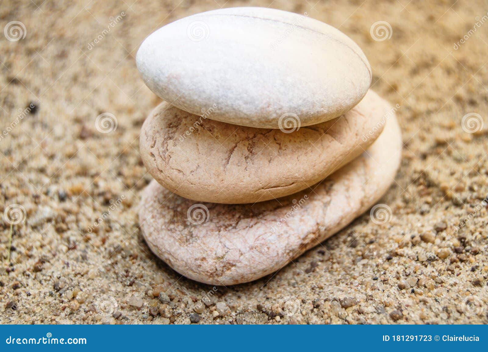 A Stack of White Stones Stacked on Yellow Sand, Low Depth of Field, Zen ...