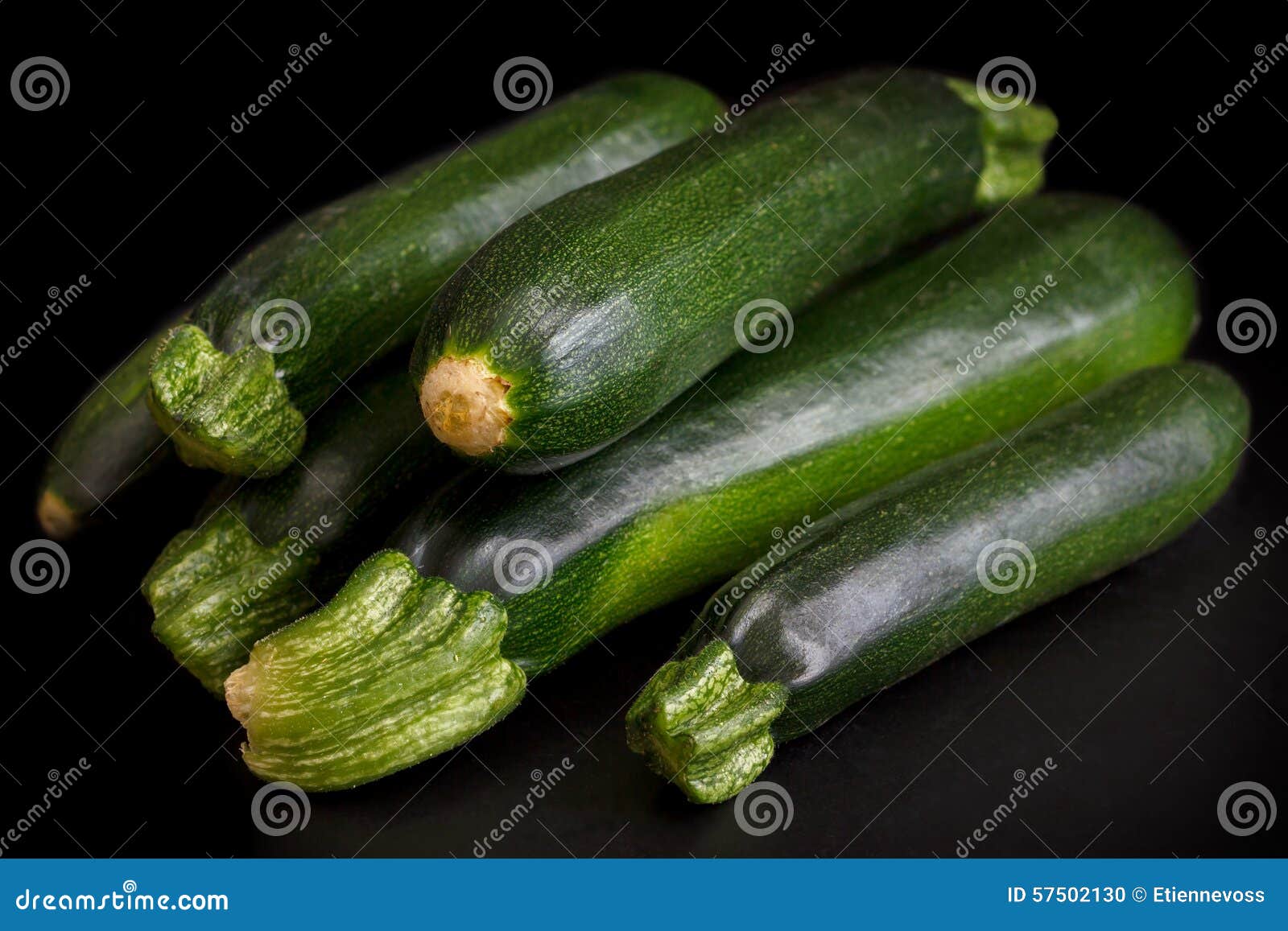 Stack of Whole Courgettes Isolated on Black. Stock Photo - Image of ...