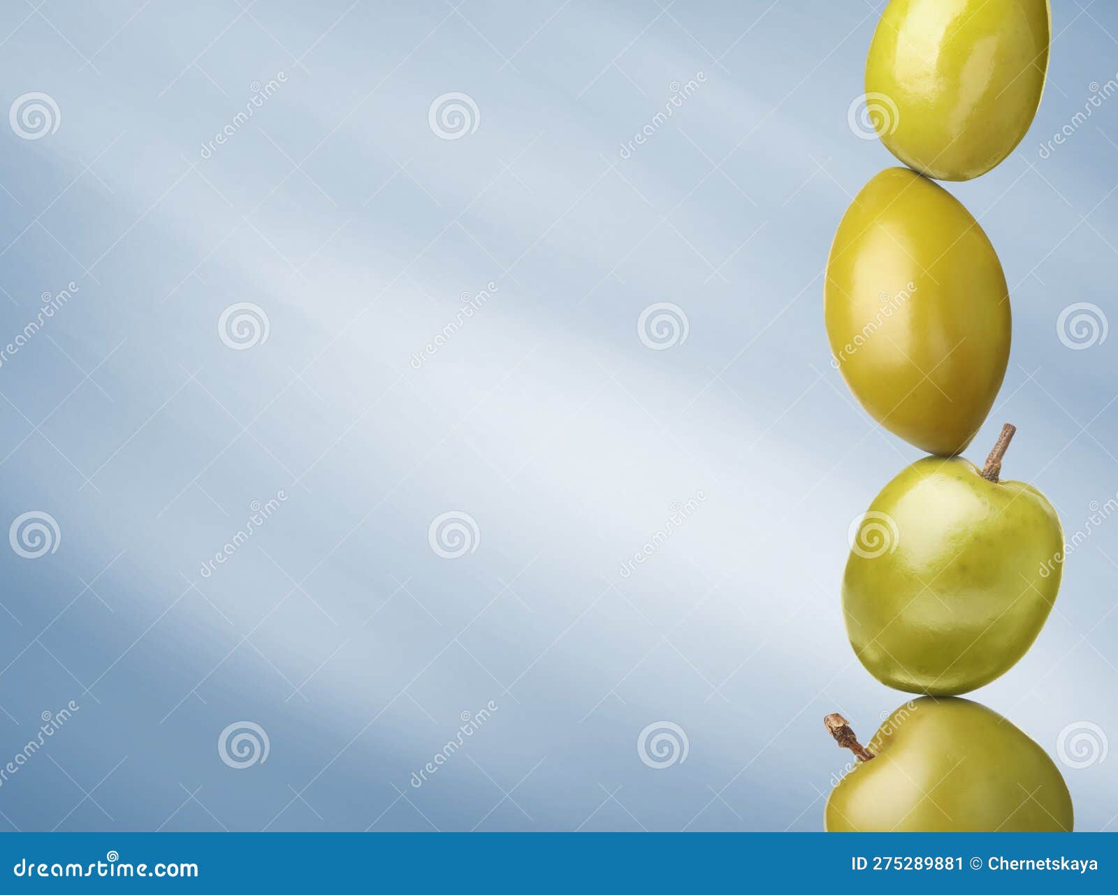 Stack of Whole Green Olives on Pastel Light Blue Gradient Background ...