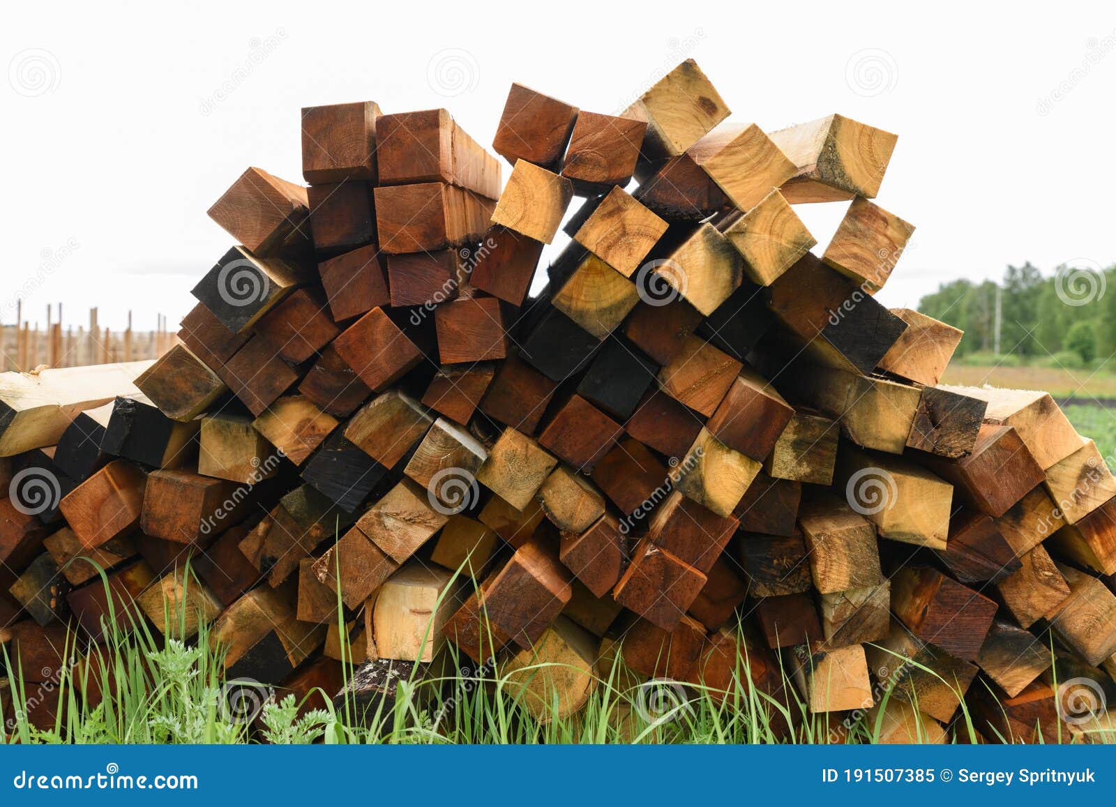Stack of Wooden Bars in Warehouse. Stacked Wooden Beams of Square ...