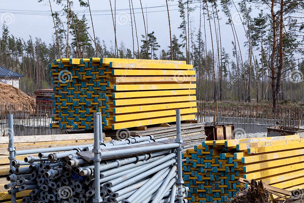 Stack of Wooden Beams and Metal Pipes for Framing or Structural Support ...