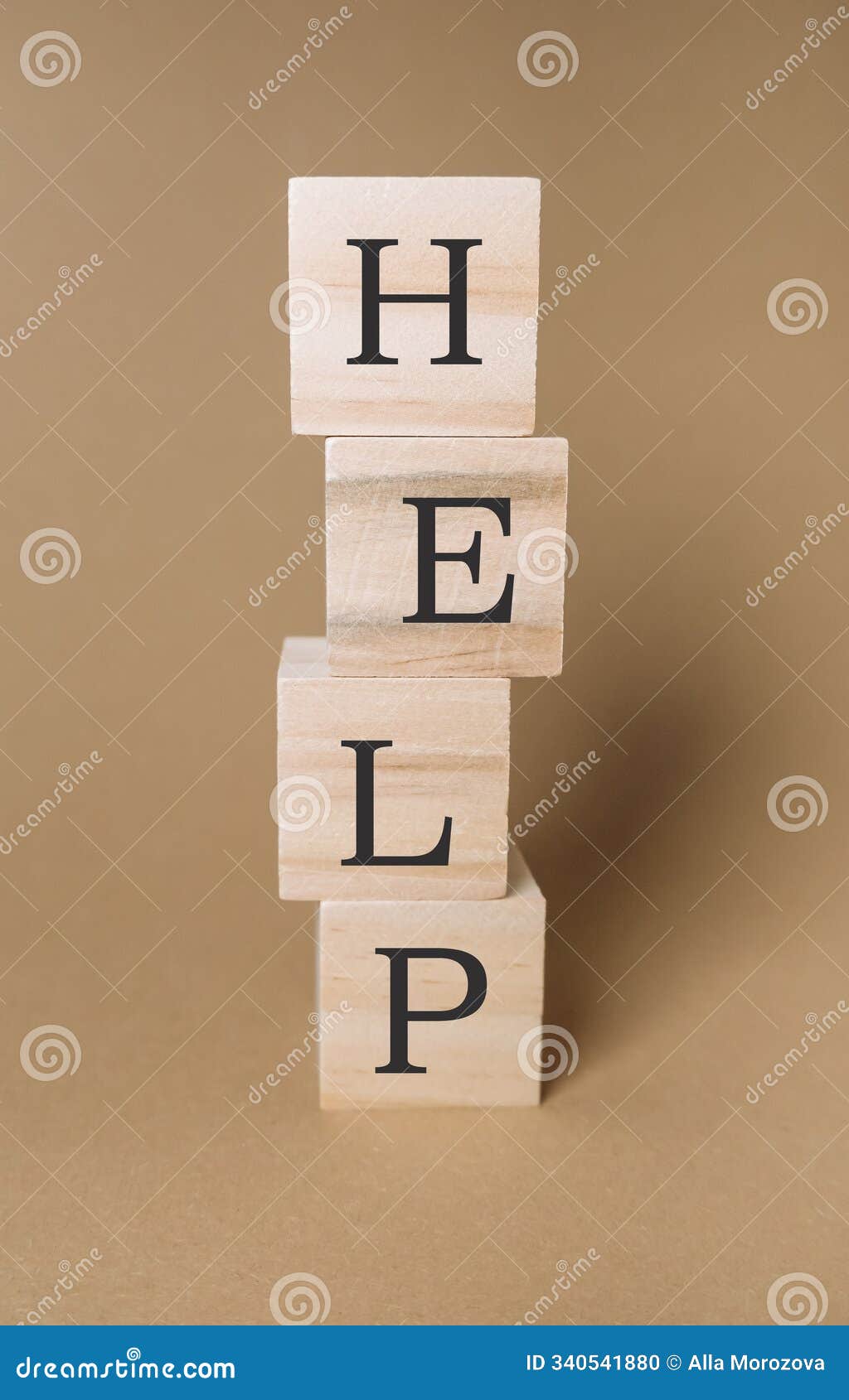 A Stack of Wooden Blocks with the Word HELP Written on Them Stock Photo ...