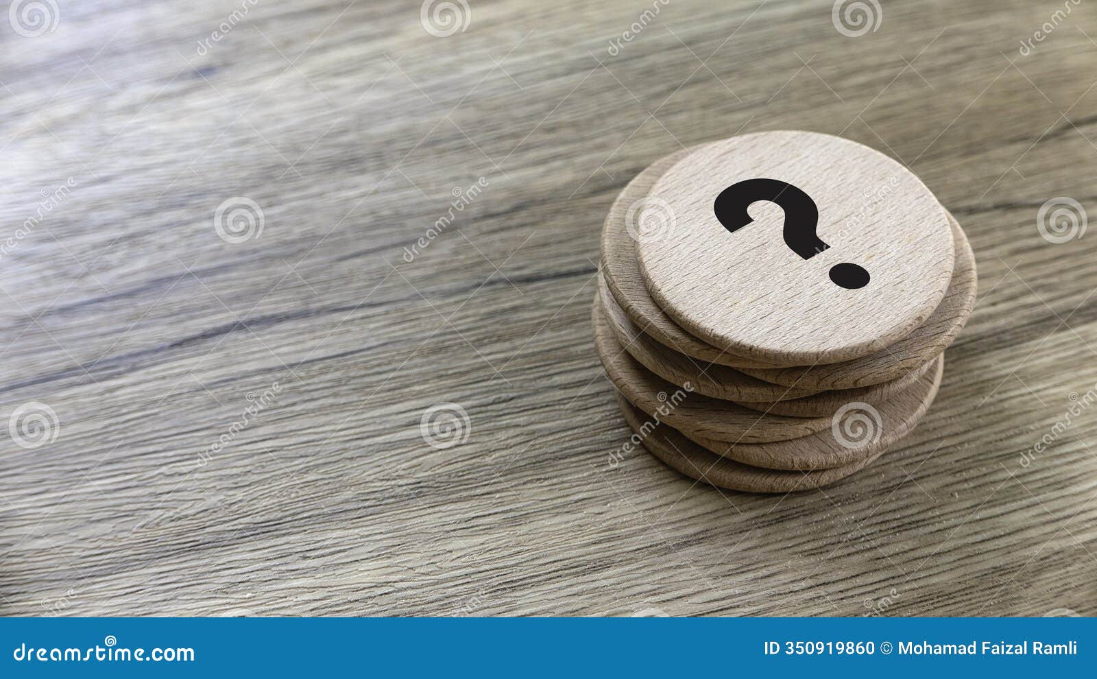Stack of Wooden Discs with Question Mark Symbol on Wooden Surface Stock ...