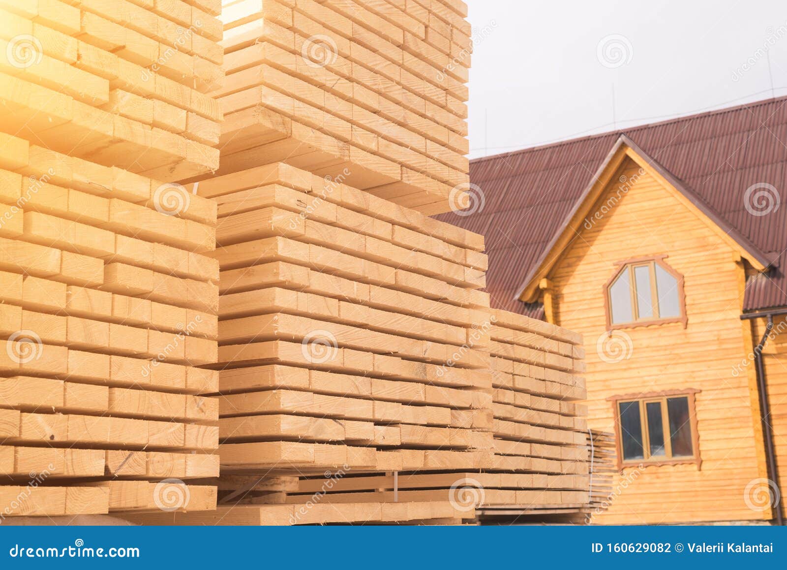Stack of Wooden Material for Building. New Big Wooden House Stock Photo ...