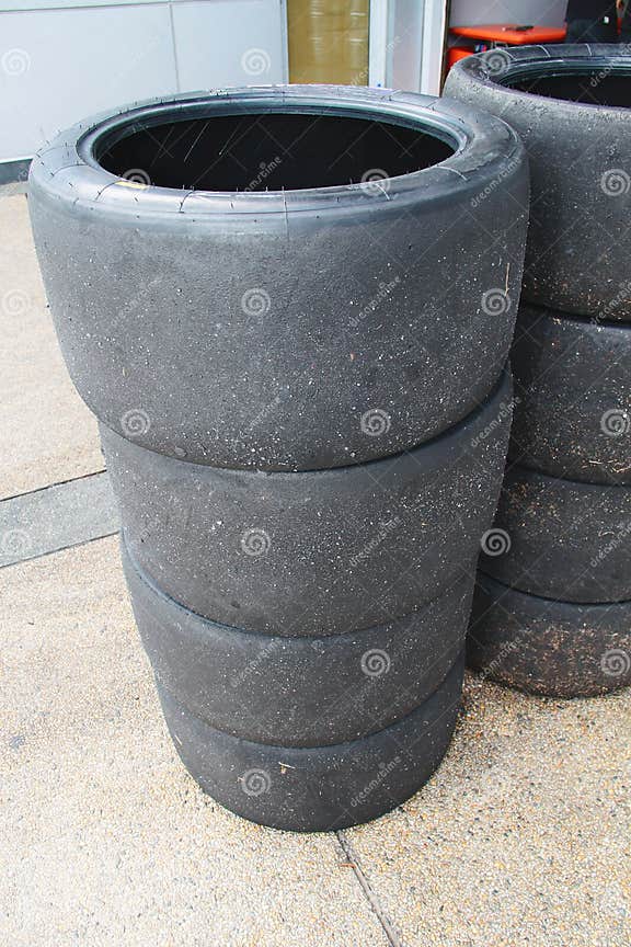 Stack of worn racing tyres stock image. Image of dirt - 15845161