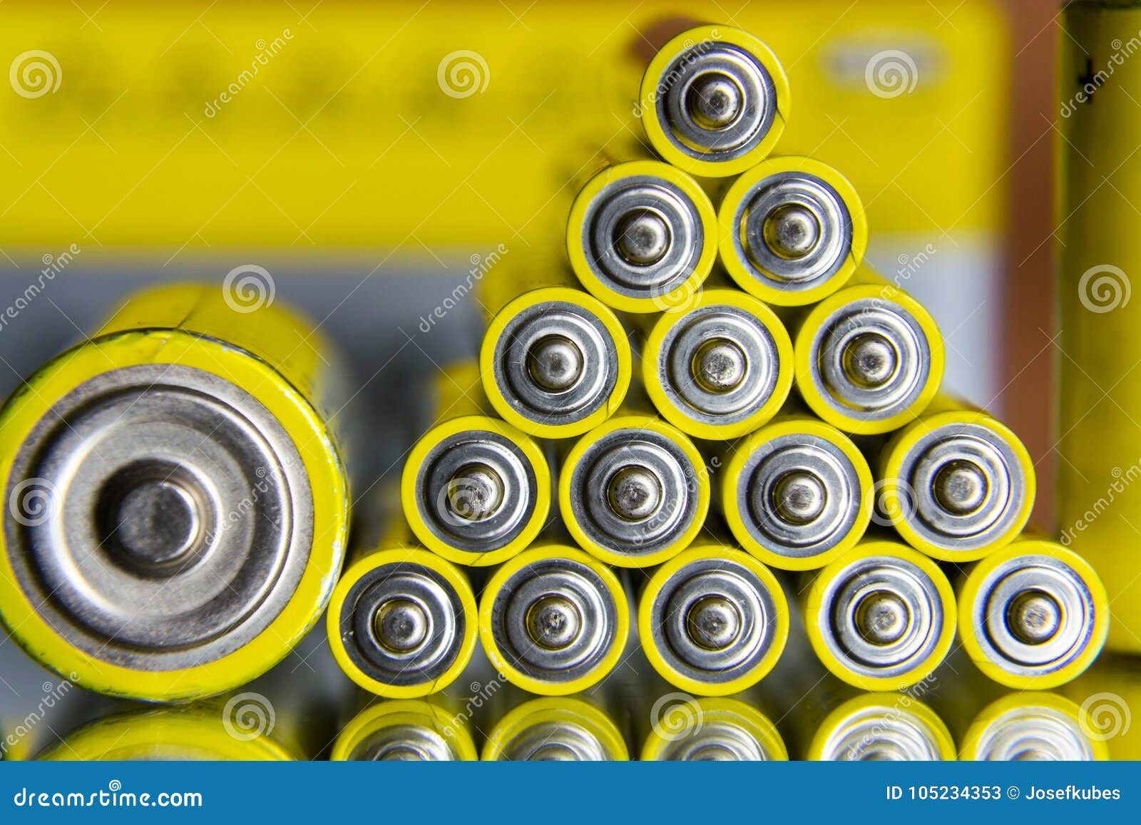 Stack of Yellow AA Batteries Close Up Abstract Coloured Background ...
