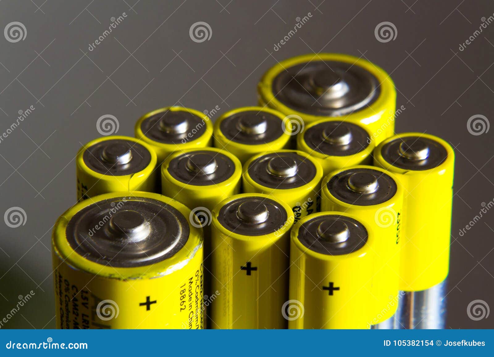 Stack of Yellow AA Batteries Close Up, Electricity Storage Concept ...