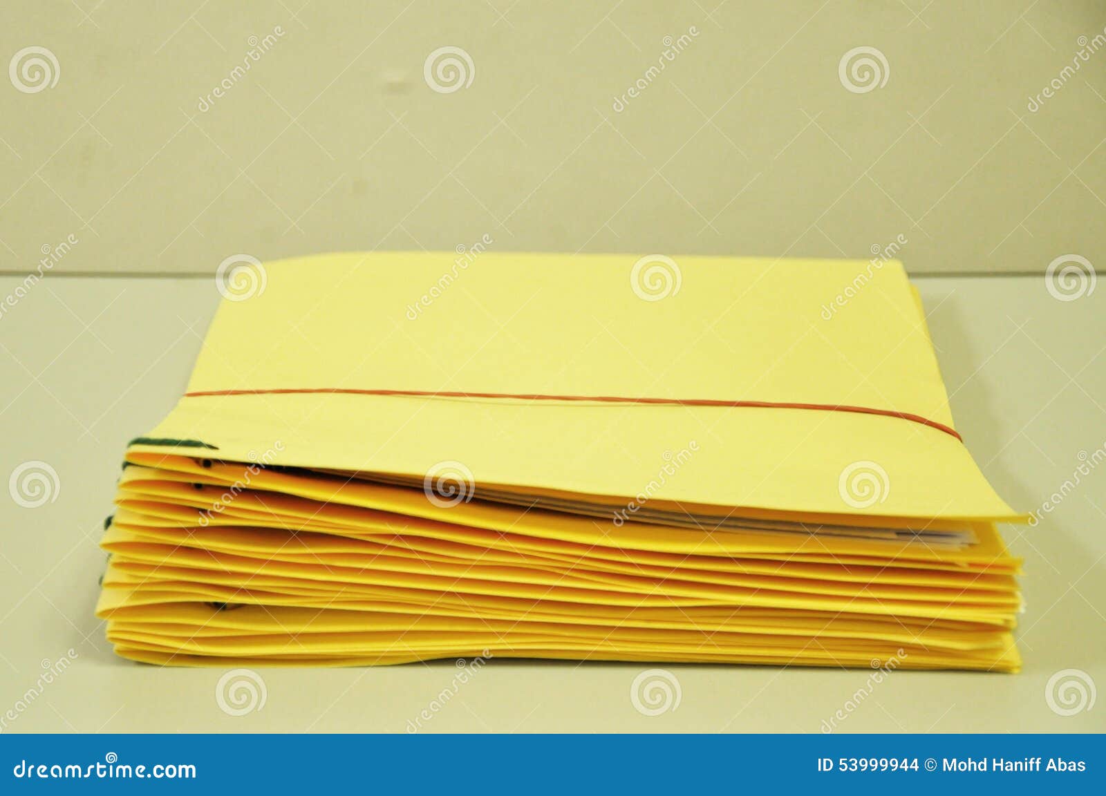 Stack of Yellow Folders on the Table Stock Photo - Image of graphic ...
