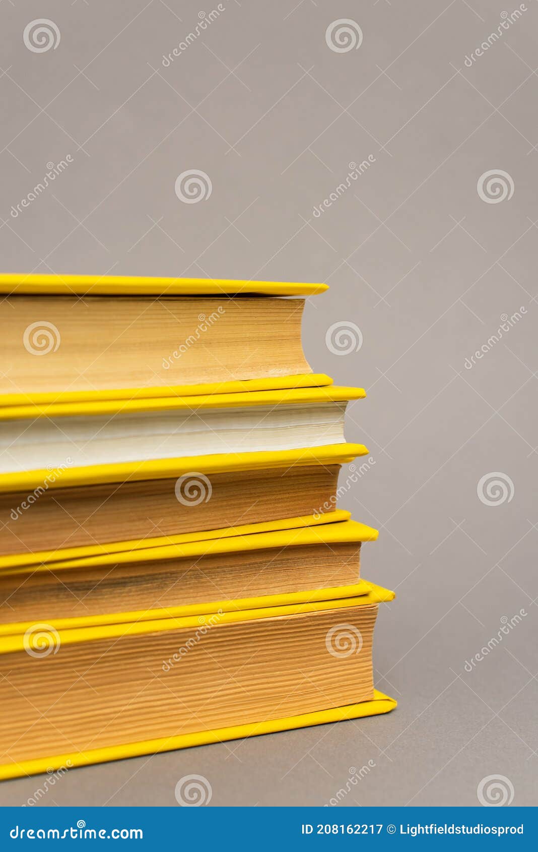Stack of Yellow Notebooks Isolated on Grey. Stock Image - Image of ...