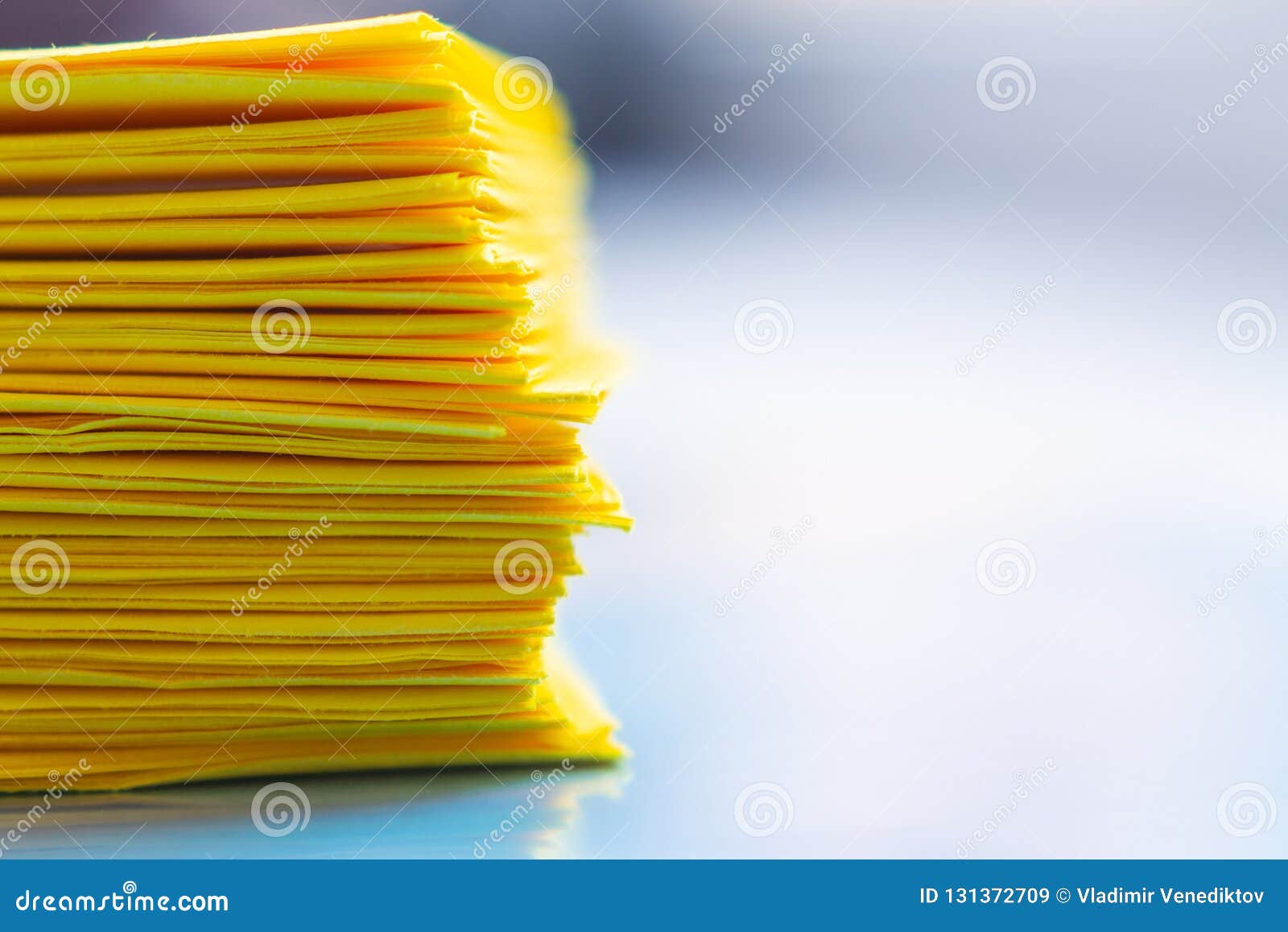 Stack of Yellow Paper on Blue Table Stock Image - Image of futuristic ...