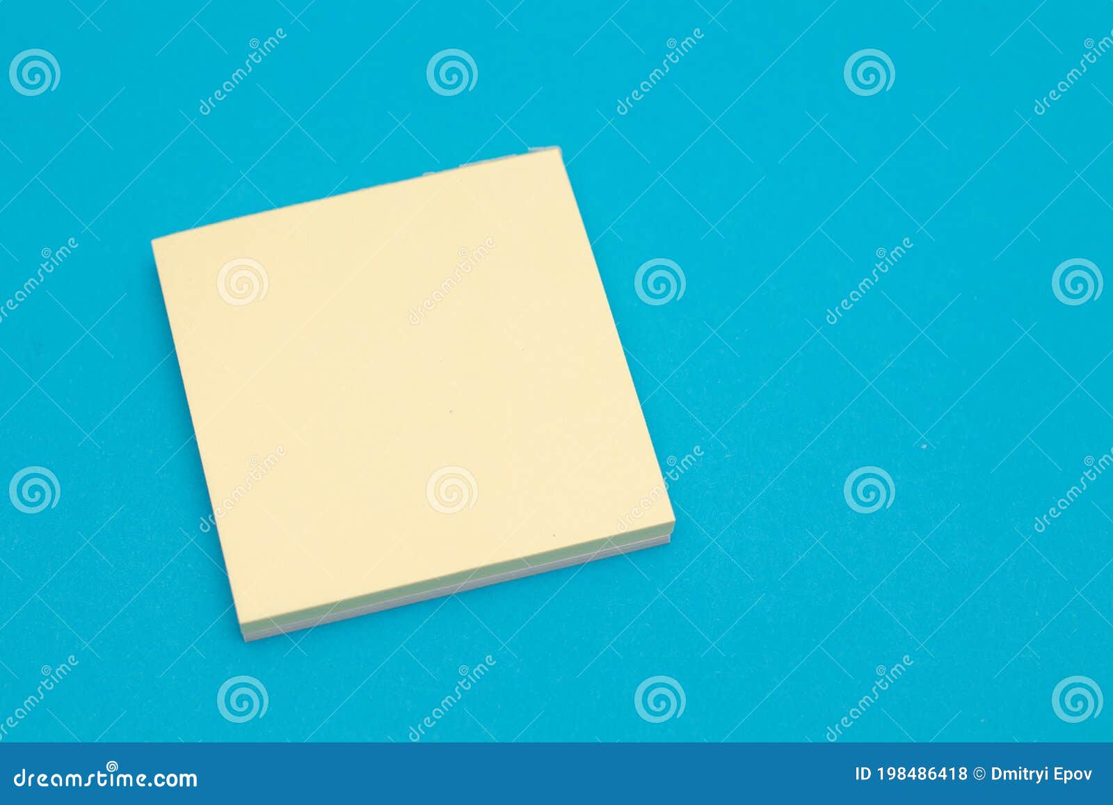 Stack of Yellow Paper Stickers on Blue Background Stock Photo - Image ...