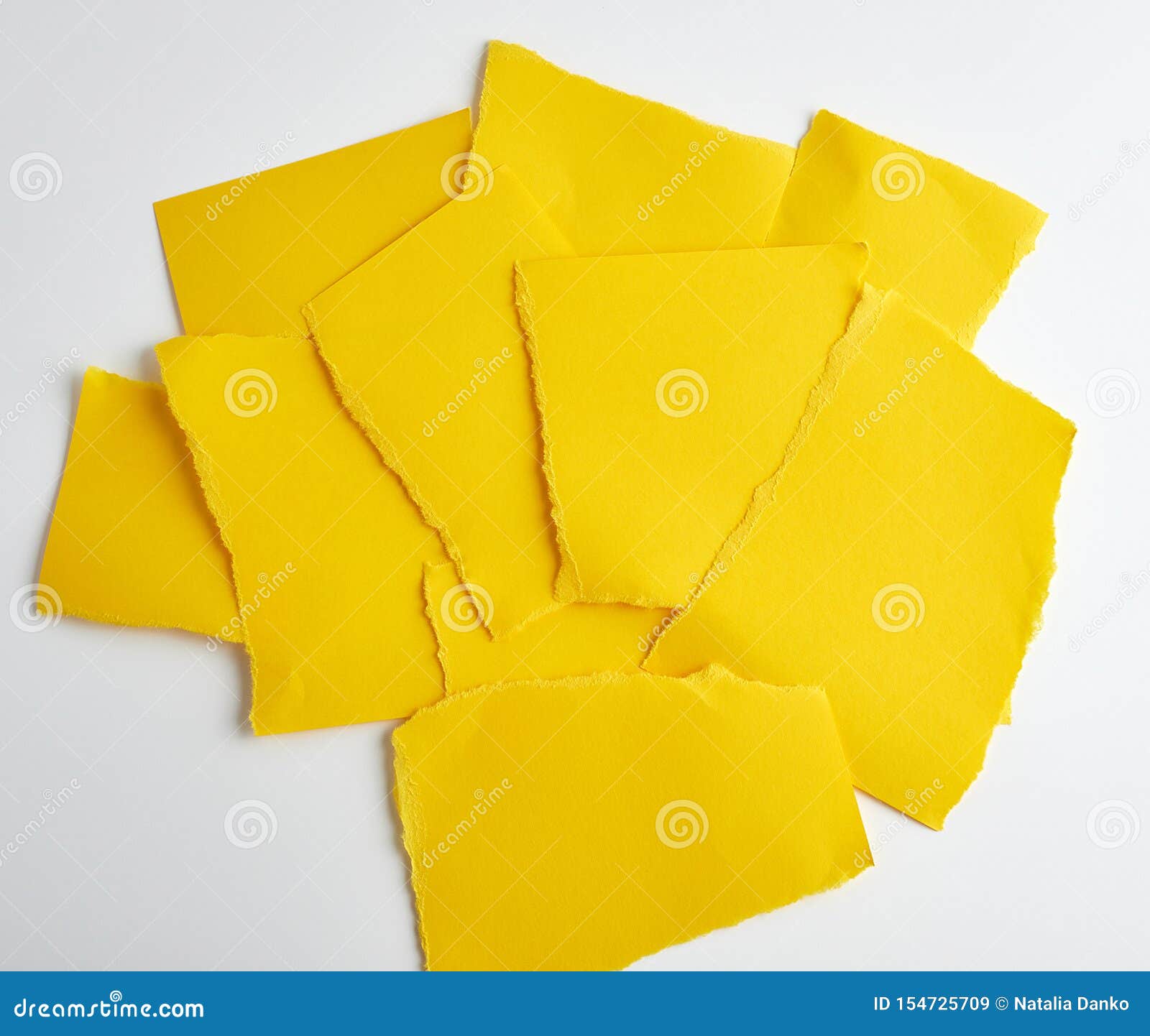 Stack of Yellow Paper Torn Pieces of Paper on a White Background Stock ...