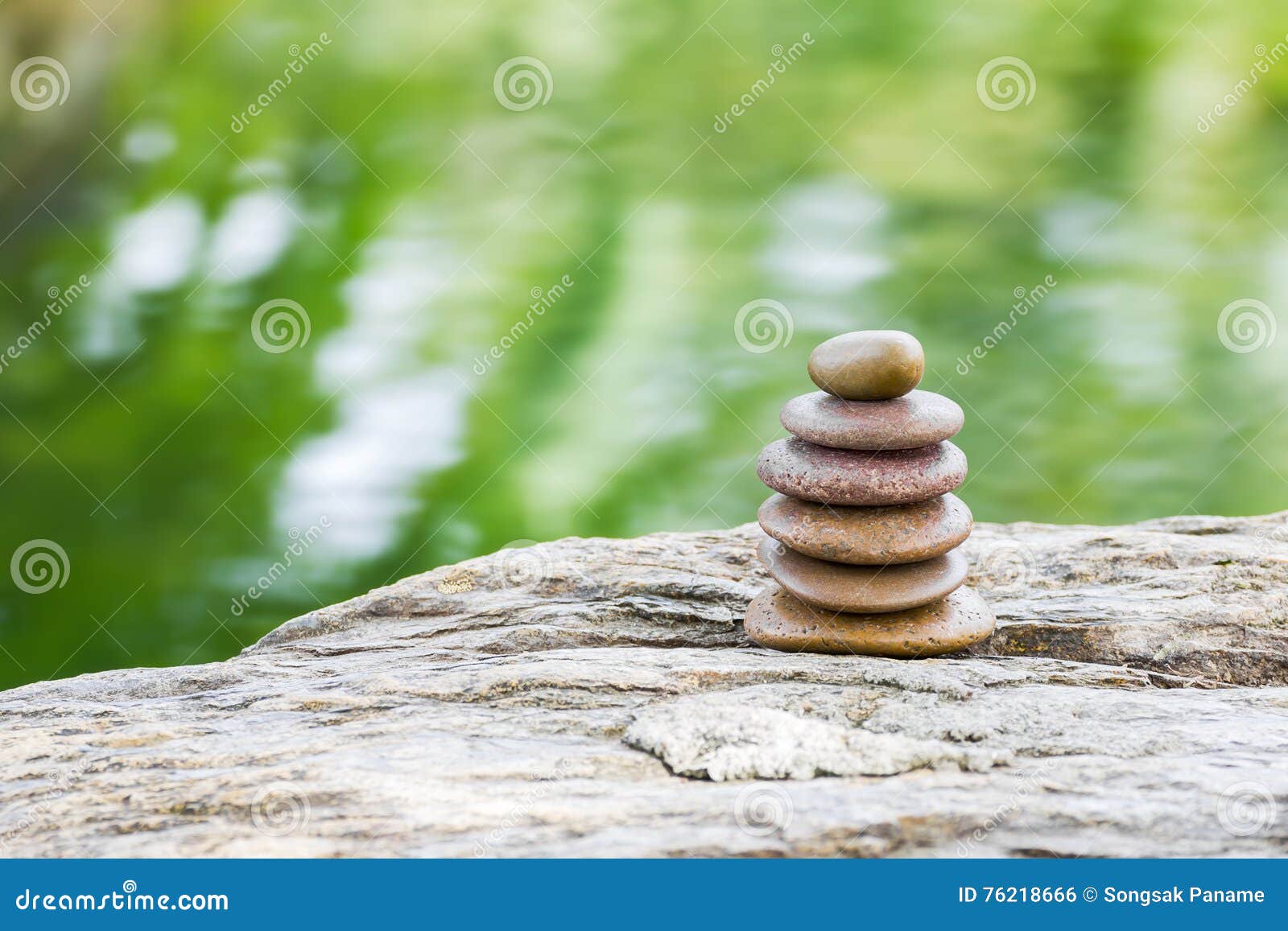 Stack of Zen Rocks in Garden Stock Photo - Image of balance, green ...