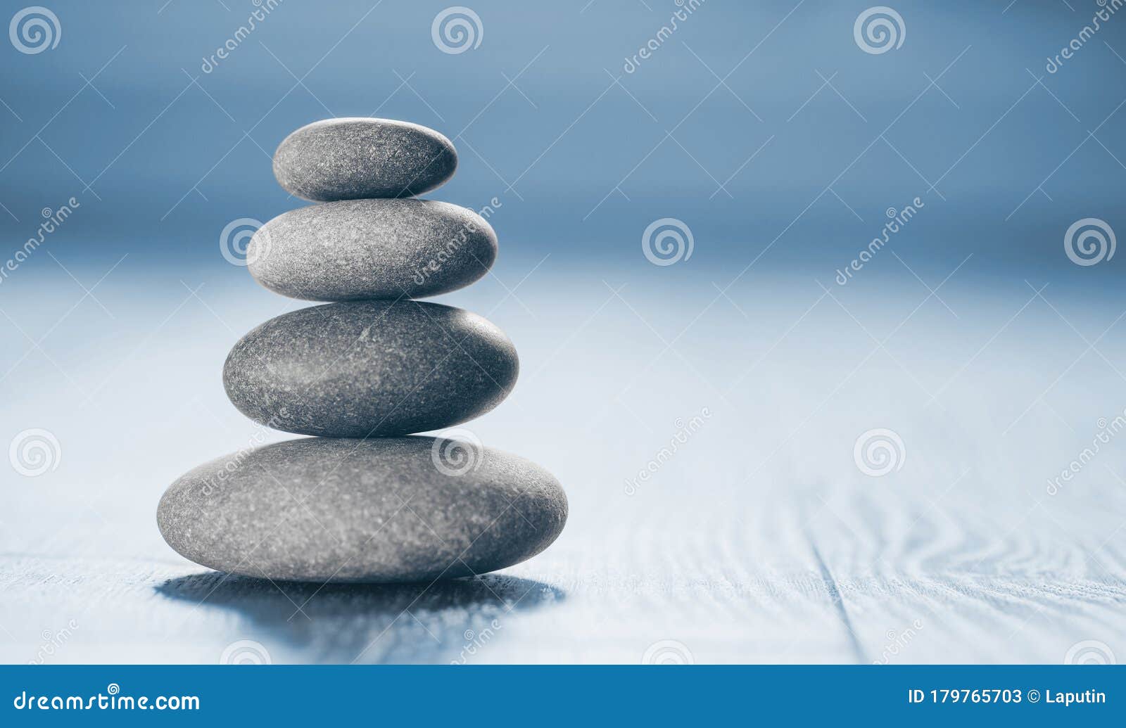 Stack of Zen Stones on Blue Background. Stock Image - Image of smooth ...