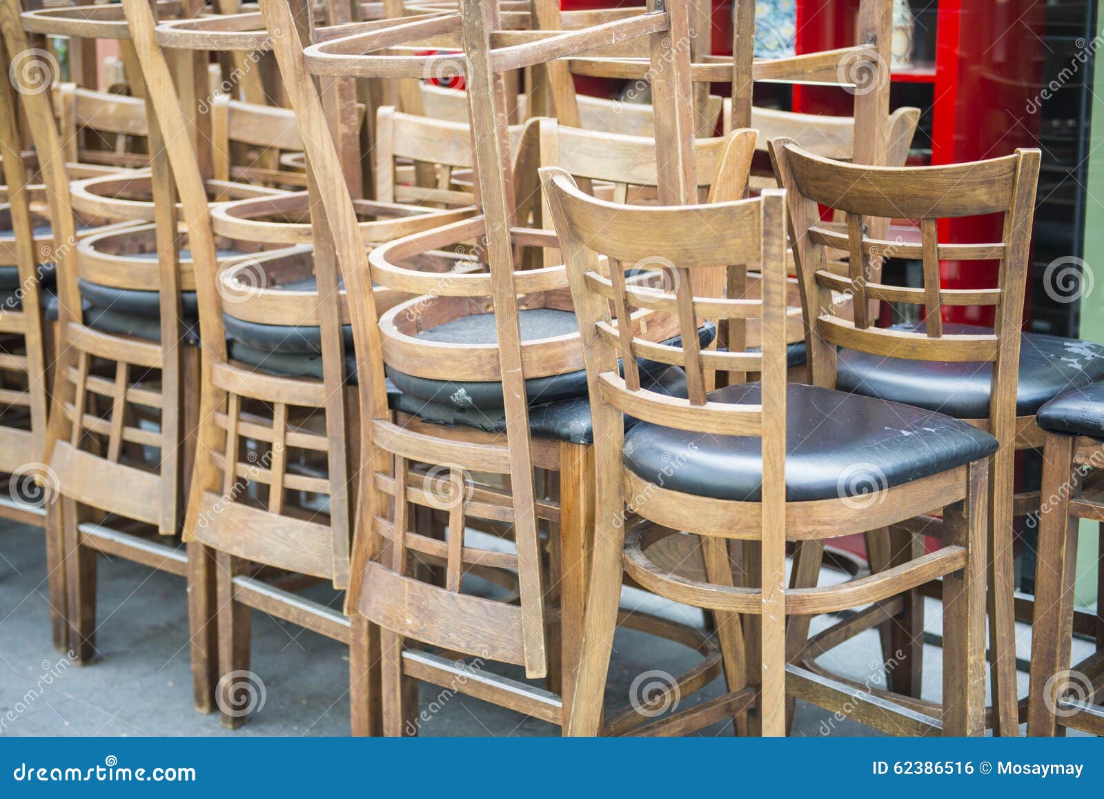 Stackable Wood Chairs in Restaurant Stock Photo - Image of close, seat ...
