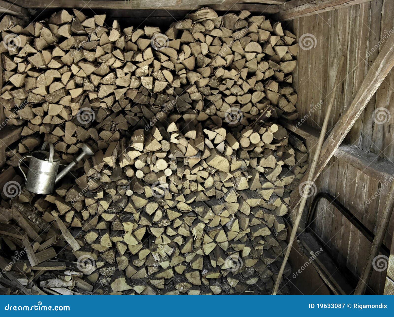 Chopped Firewood Stacked Between Two Trees Royalty-Free Stock Photo ...