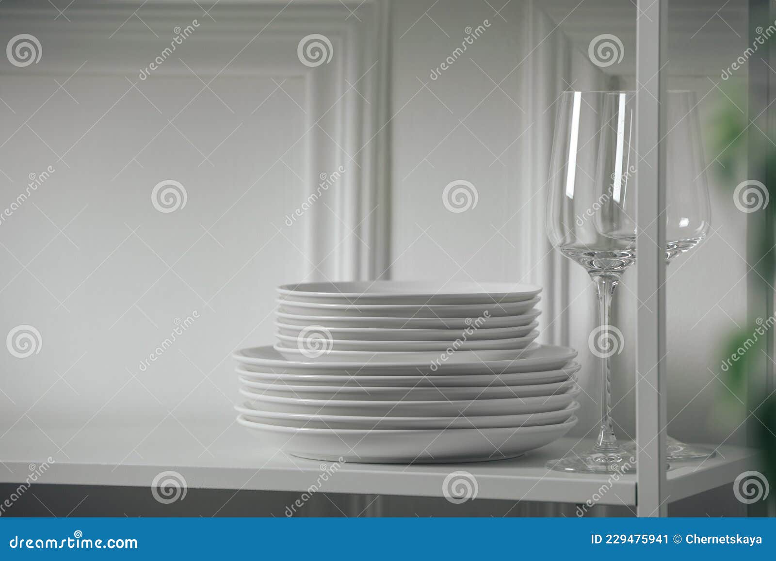 Stacked Clean Dishes and Glasses on Table Indoors Stock Image - Image ...