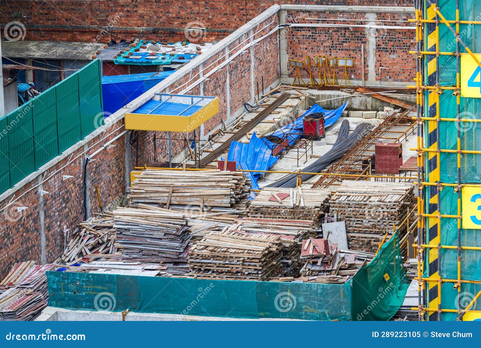 Stacked Construction Materials and Tools at a Building Site Editorial ...