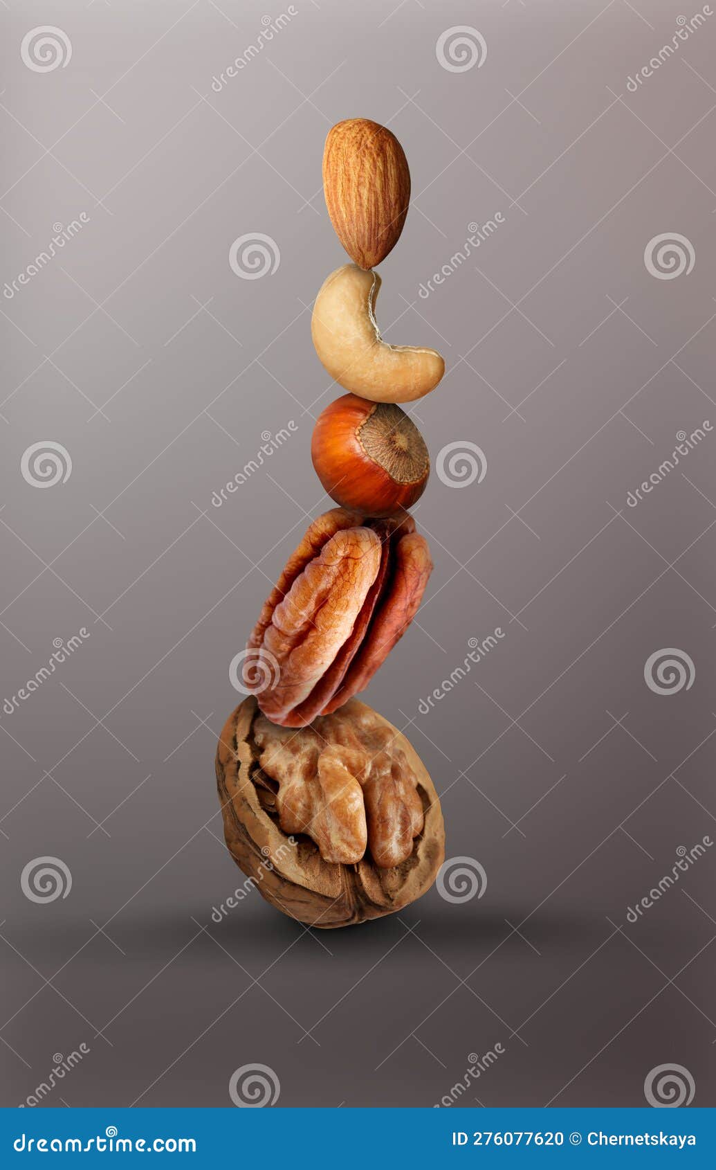 Stacked Different Nuts on Light Brownish Grey Gradient Background Stock ...
