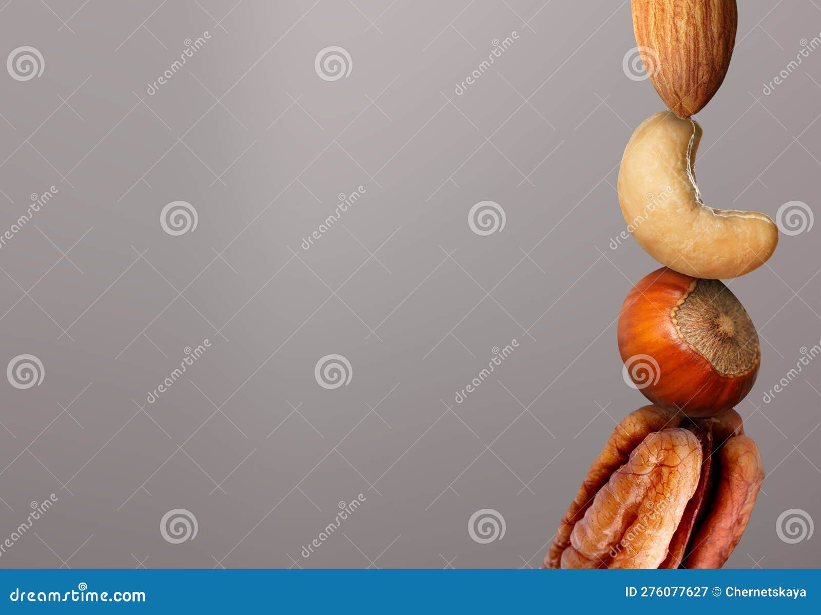 Stacked Different Nuts on Light Grey Gradient Background, Space for ...