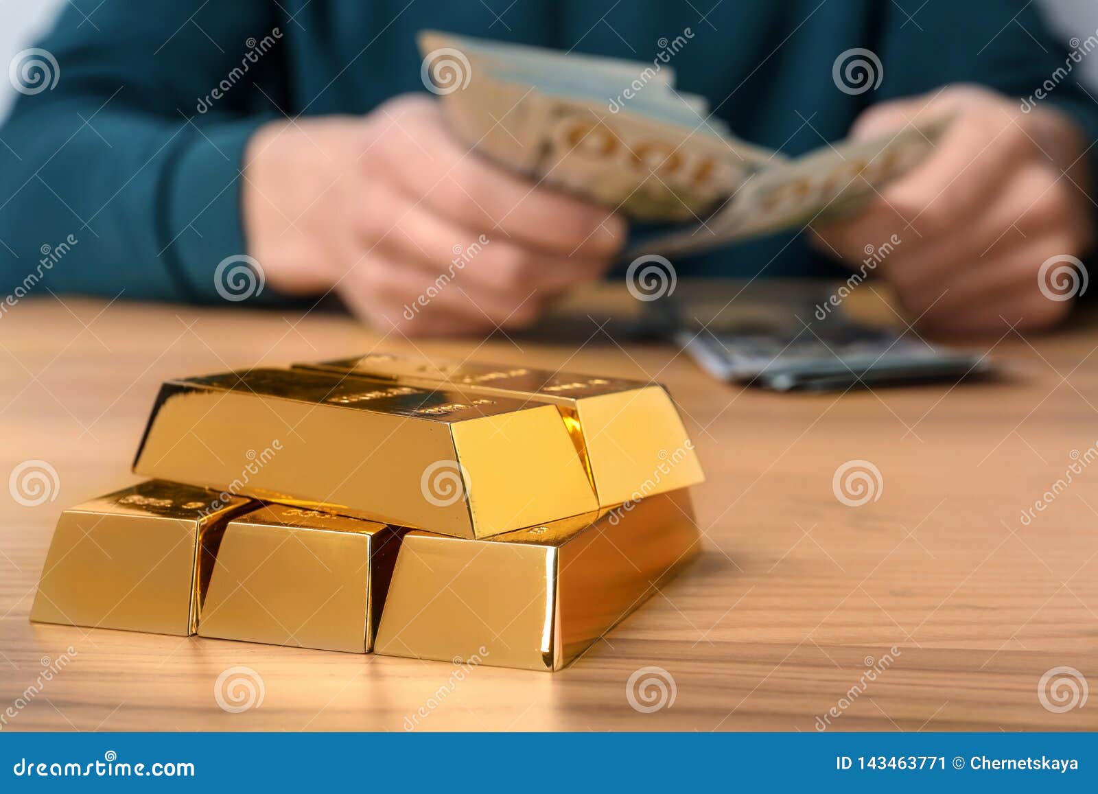 Stacked Gold Bars and Man Counting Money, Closeup. Space for Text Stock ...