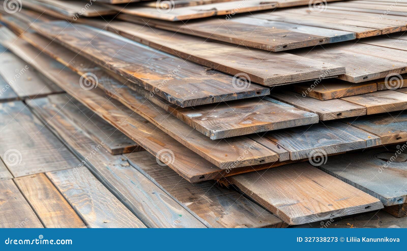 Stacked Lumber Beams Sit on the Ground at a New Home Construction Site ...