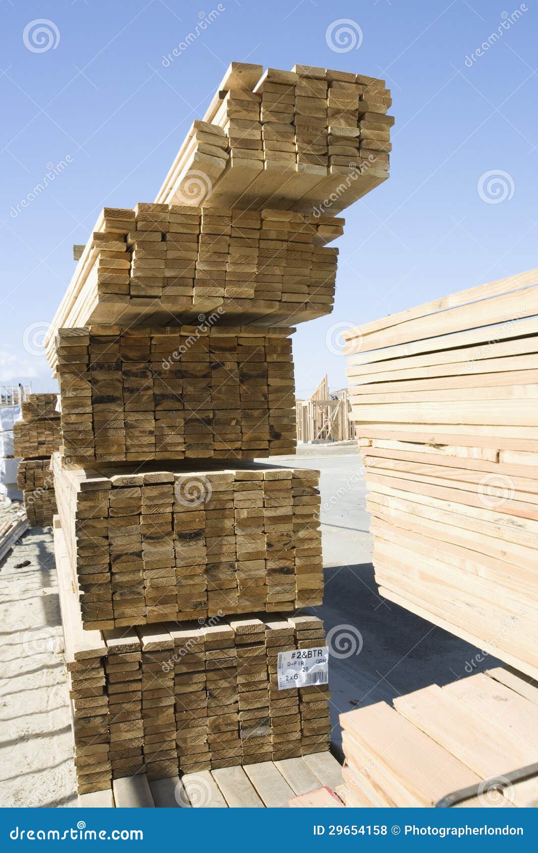 Stacked Lumber at Construction Site Stock Photo - Image of incomplete ...