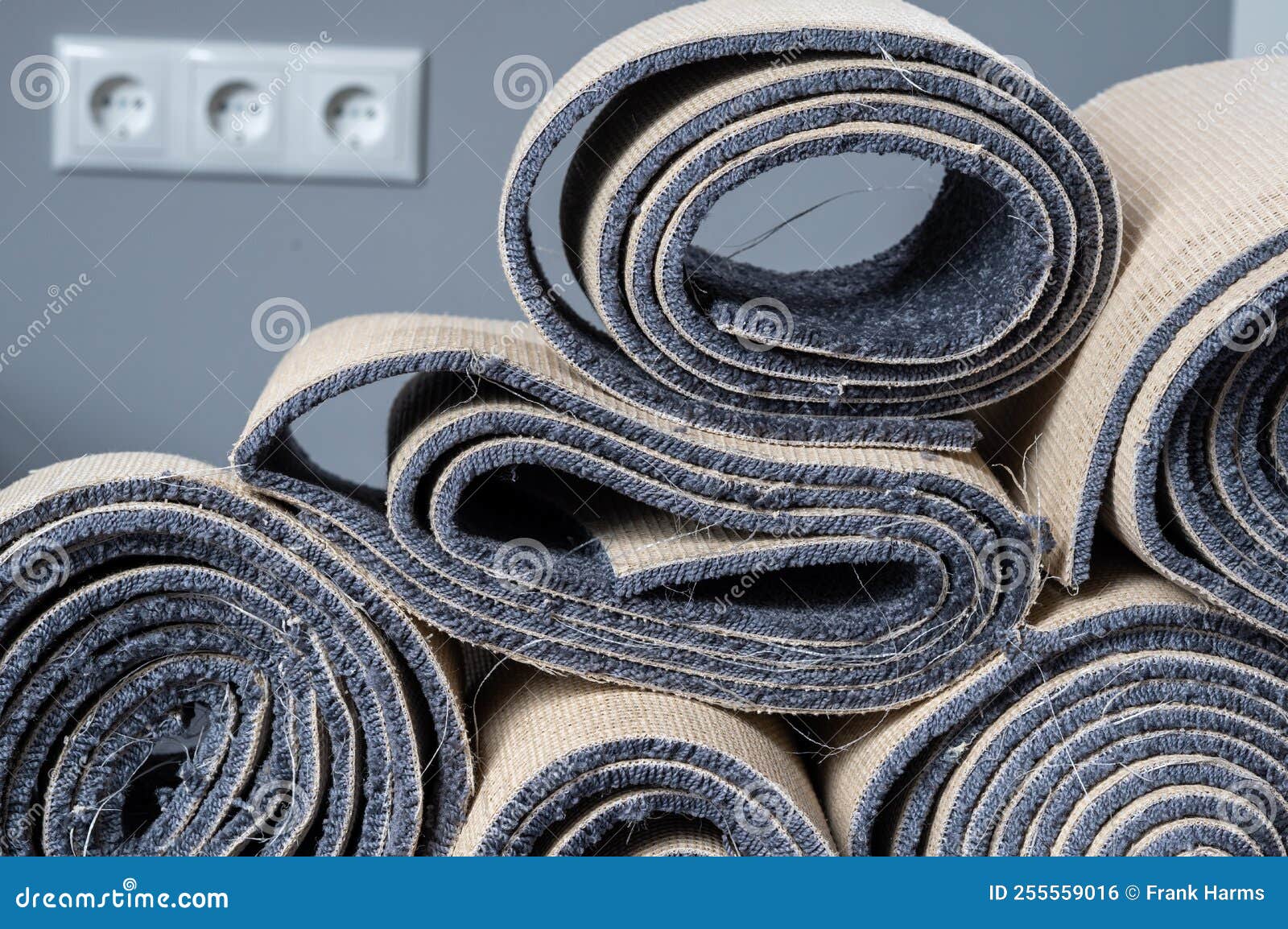 Stacked Old Carpet Rolls in a Grey Room. Stock Photo - Image of ...