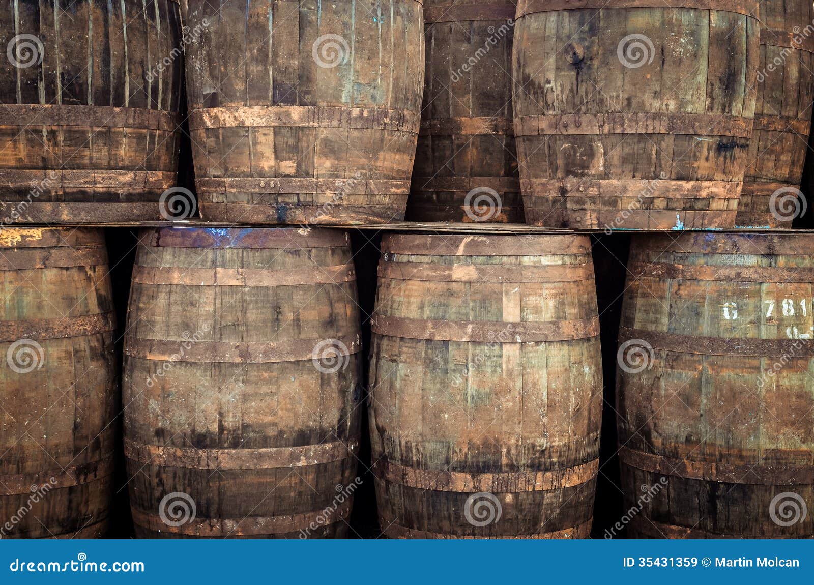Stacked old whisky barrels stock image. Image of islay - 35431359