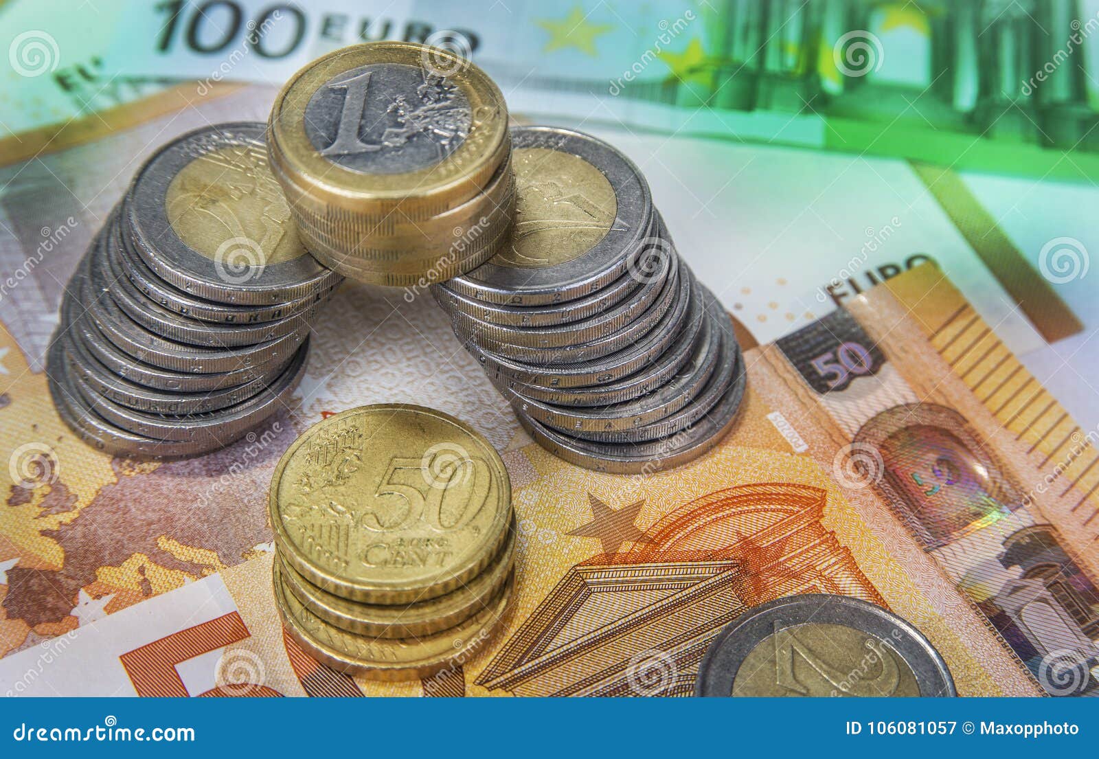 Stacked One and Two Euro Coins with Paper Banknotes Stock Image - Image ...