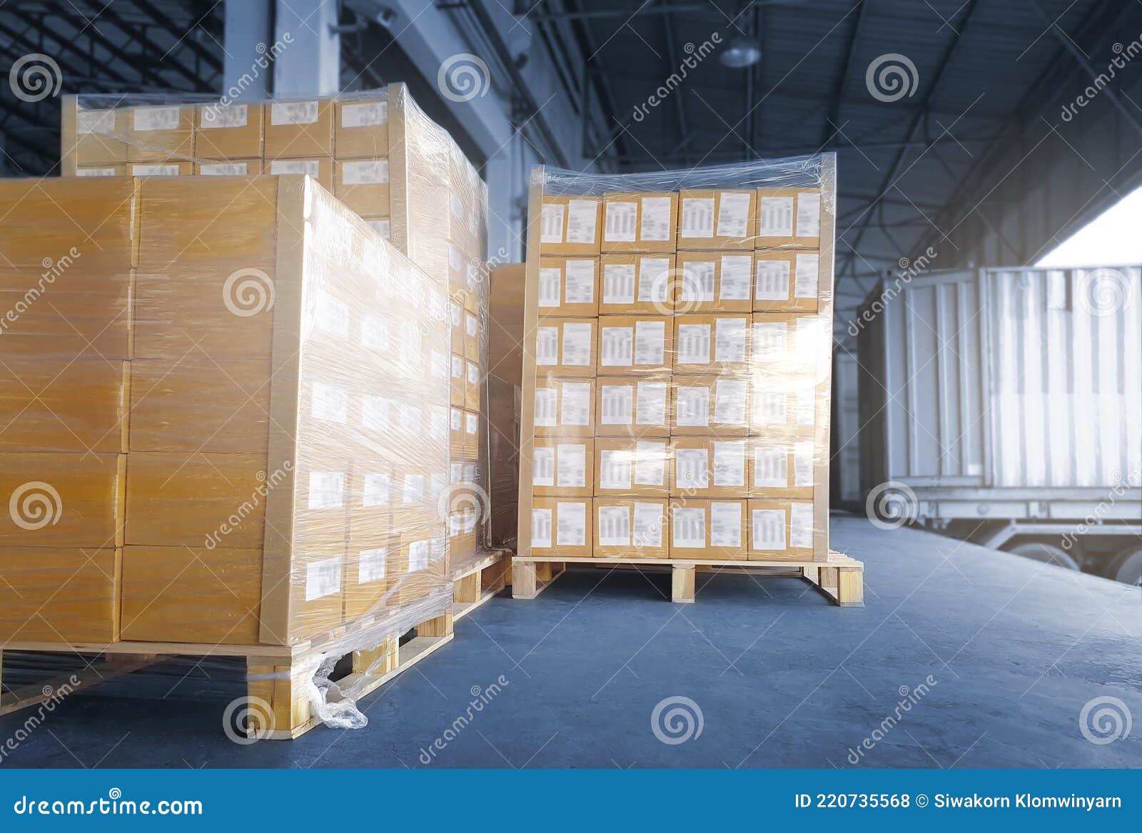 Stacked of Package Boxes Load into Cargo Container. Truck Parked ...