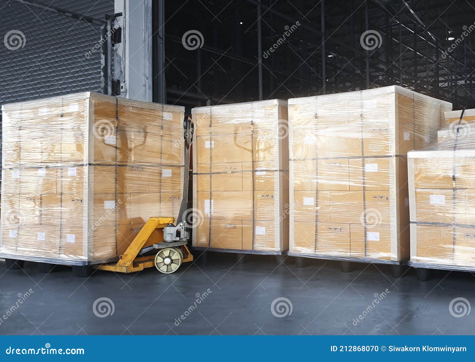Stacked of Package Boxes Wrapped Plastic on Pallet Rack. Interior of ...