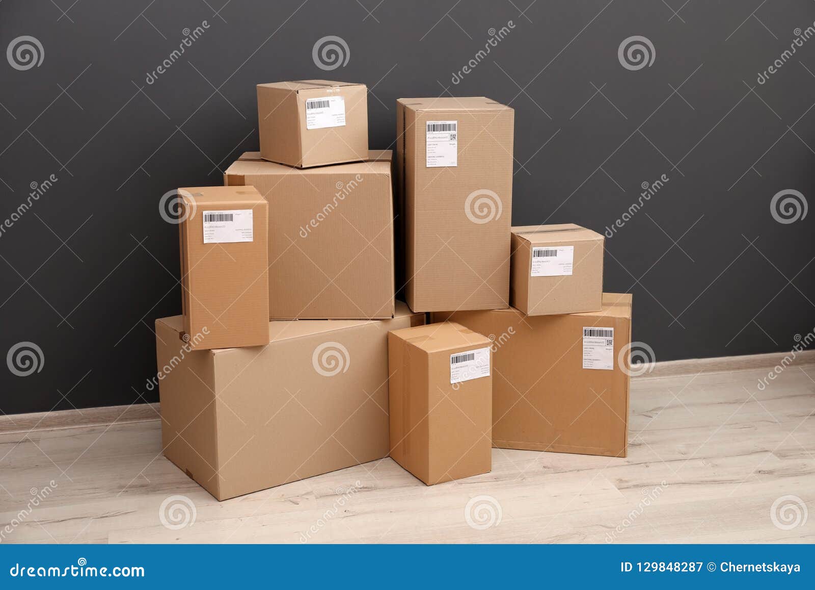 Stacked Parcel Boxes on Floor Stock Image - Image of grey, deliver ...