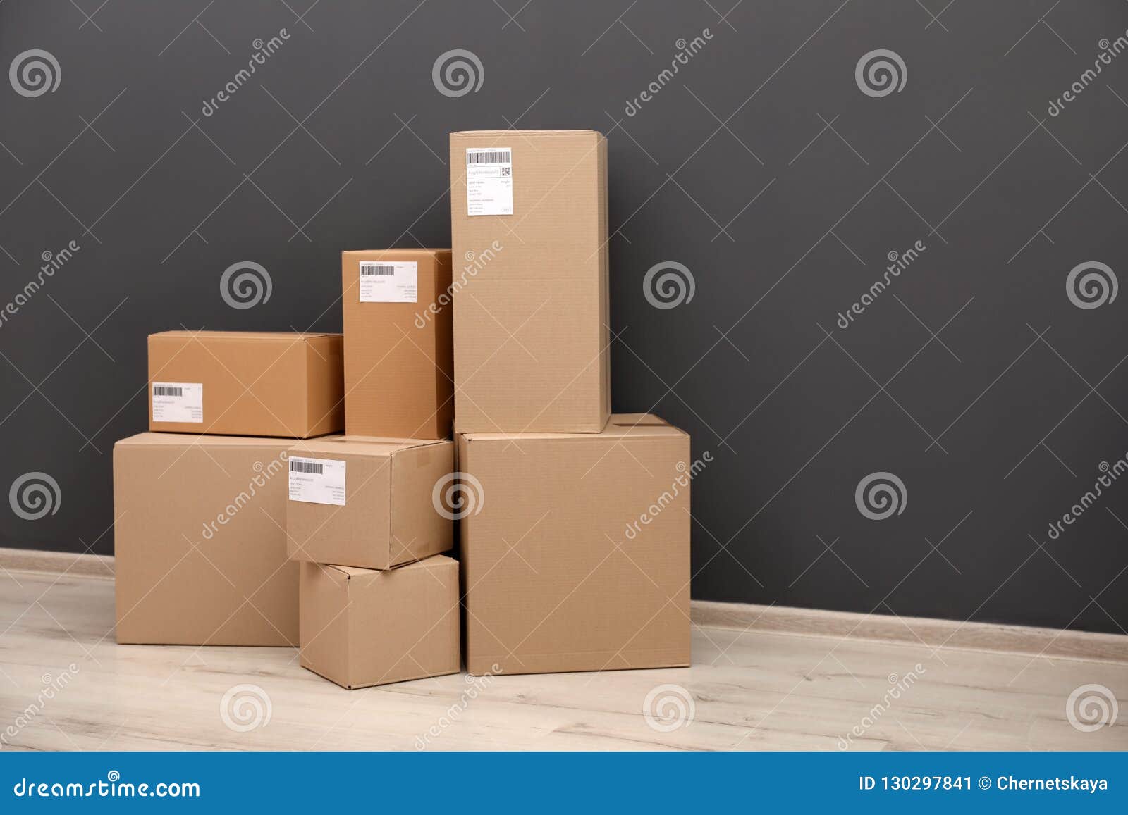 Stacked Parcel Boxes on Floor Against Wall Stock Image - Image of gift ...
