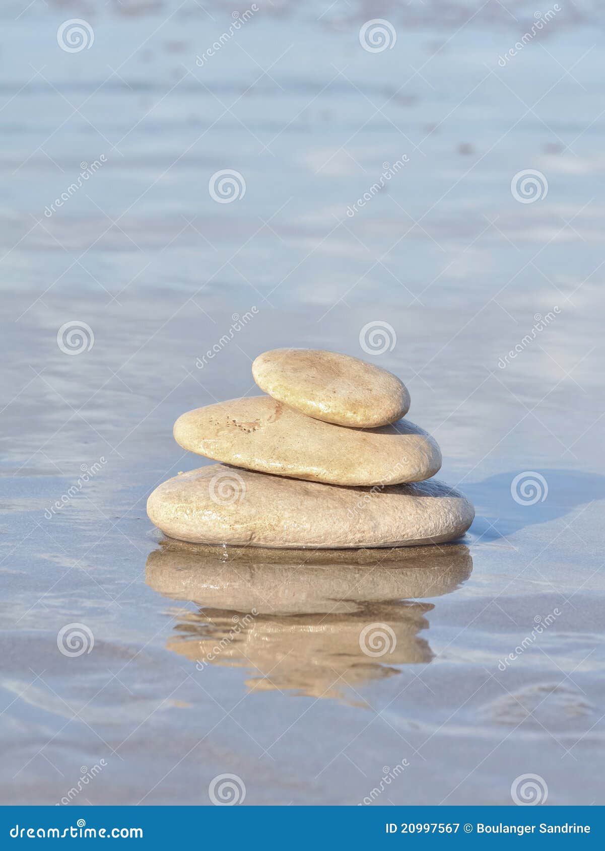 Stacked pebbles in the sea stock image. Image of simplicity - 20997567