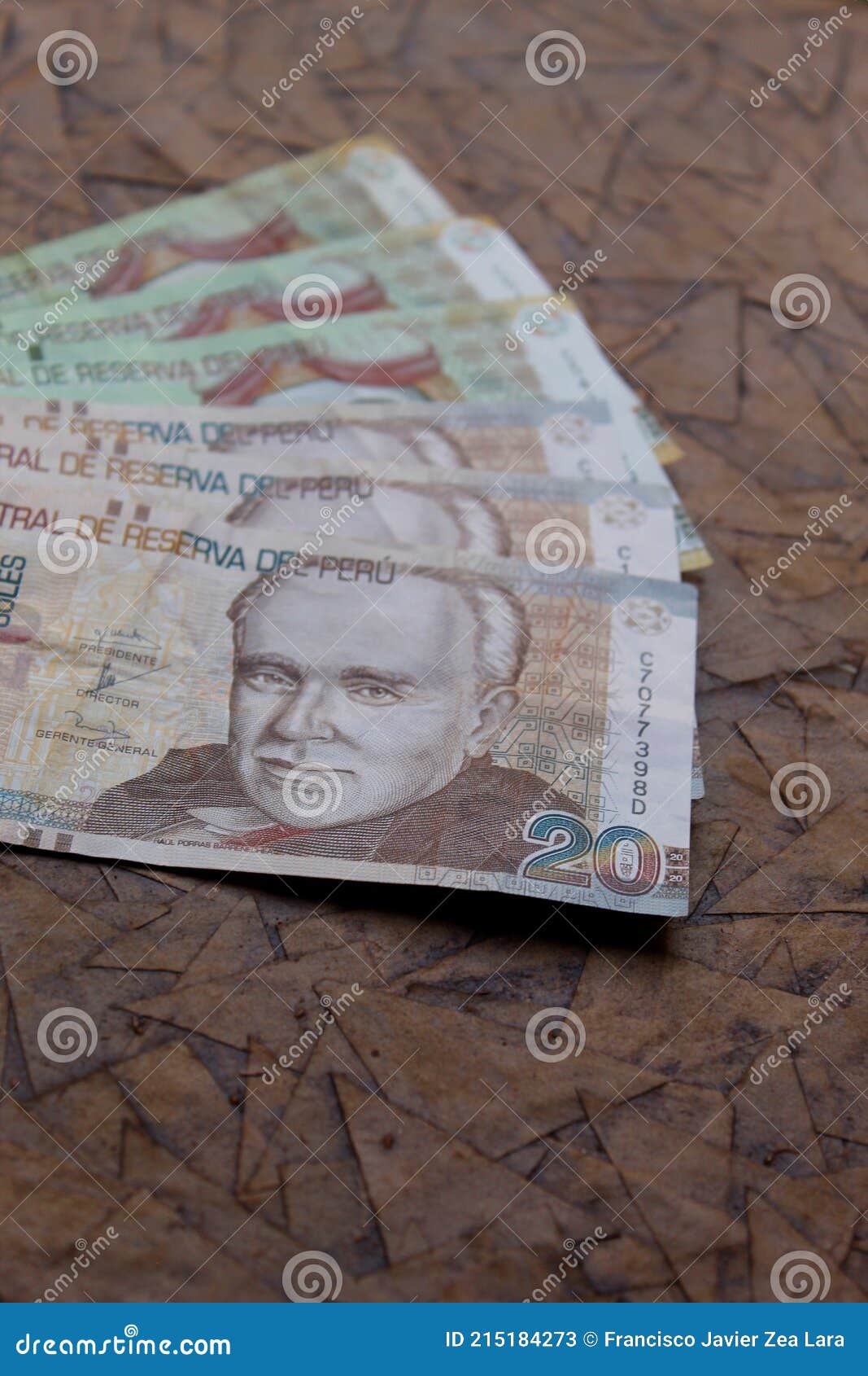 Stacked Peruvian Banknotes of Different Denomination on the Brown ...